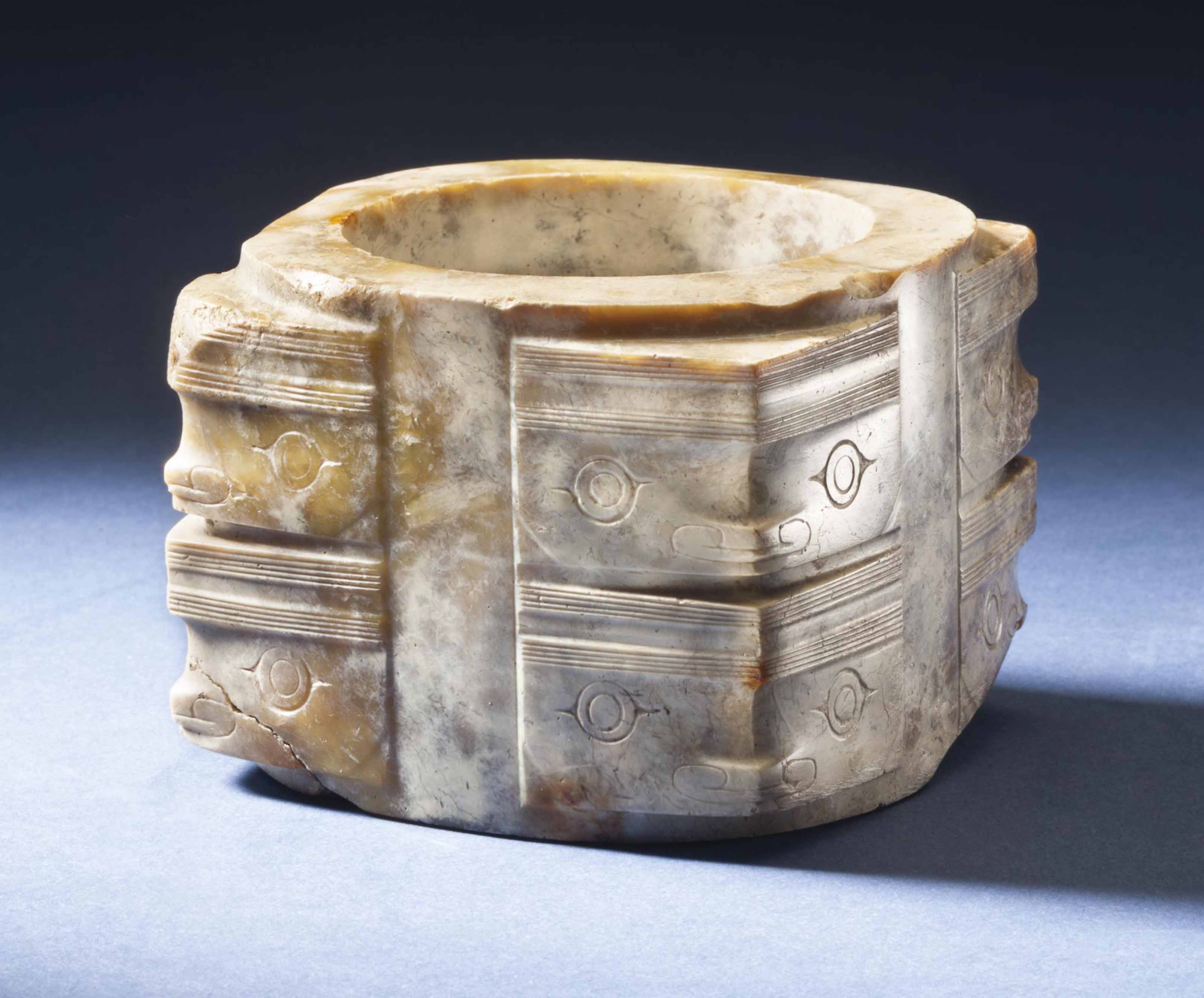 A RARE AND FINELY CARVED MOTTLED OPAQUE JADE CONG , NEOLITHIC PERIOD ...