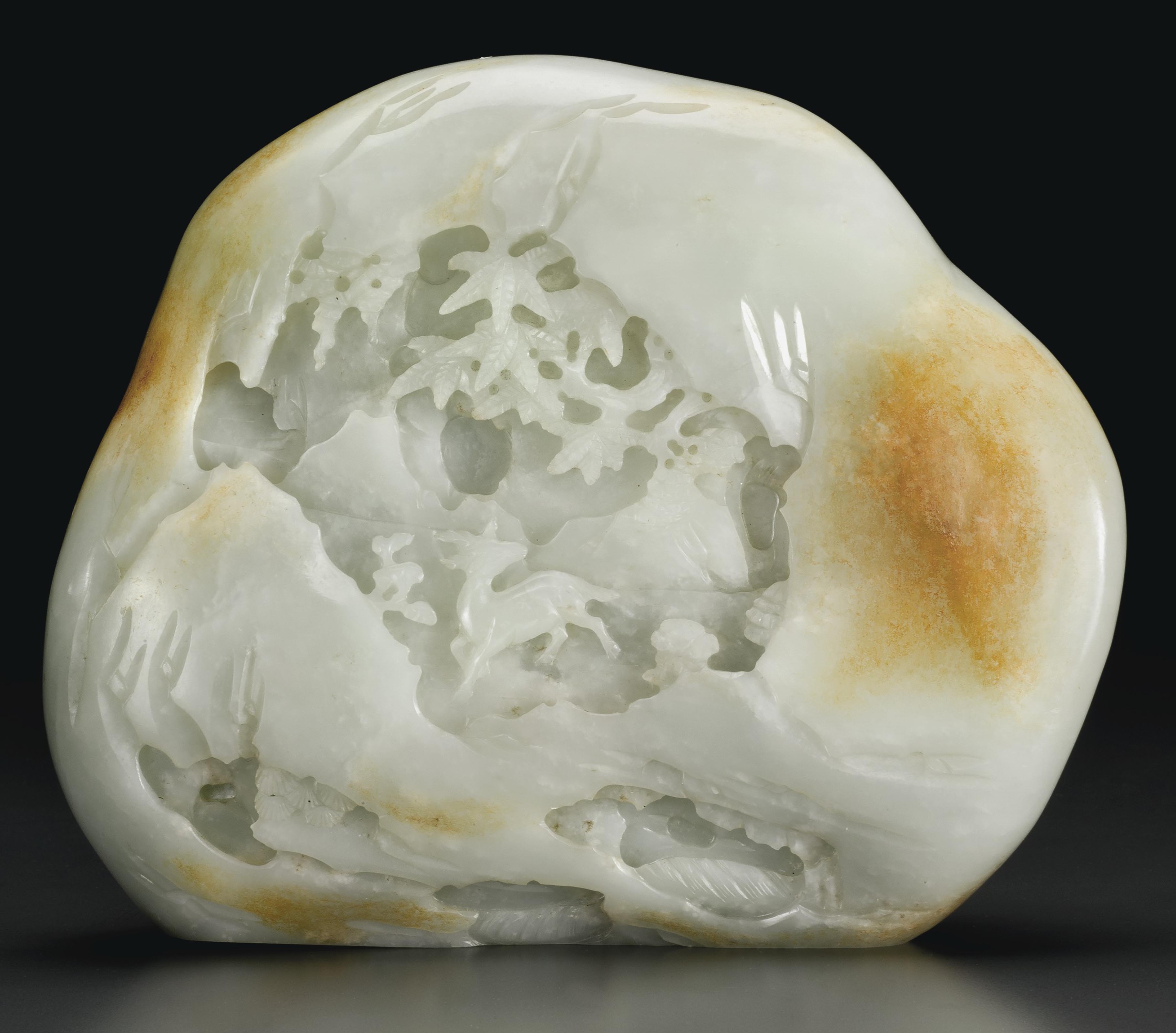 A WELL-CARVED WHITE JADE BOULDER