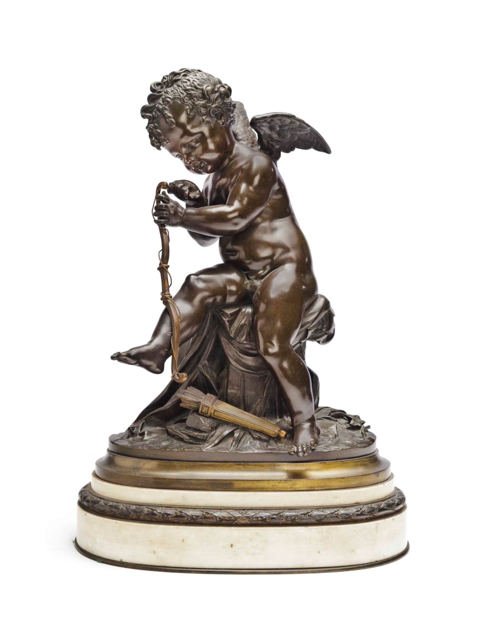 A FRENCH PATINATED BRONZE FIGURE OF CUPID STRINGING HIS BOW, AFTER A ...