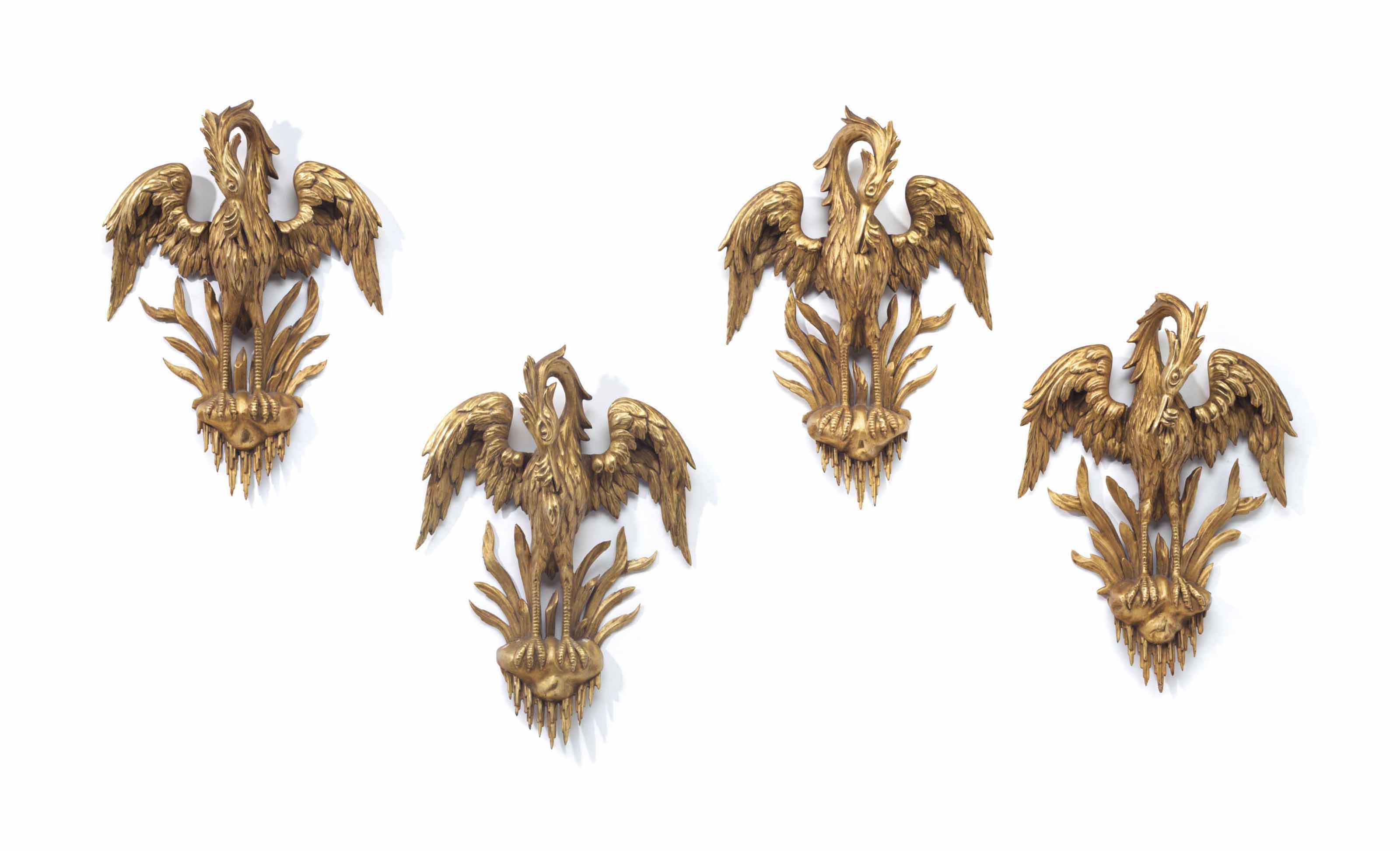 A SET OF FOUR GILTWOOD WALL CARVINGS OF HO HO BIRDS