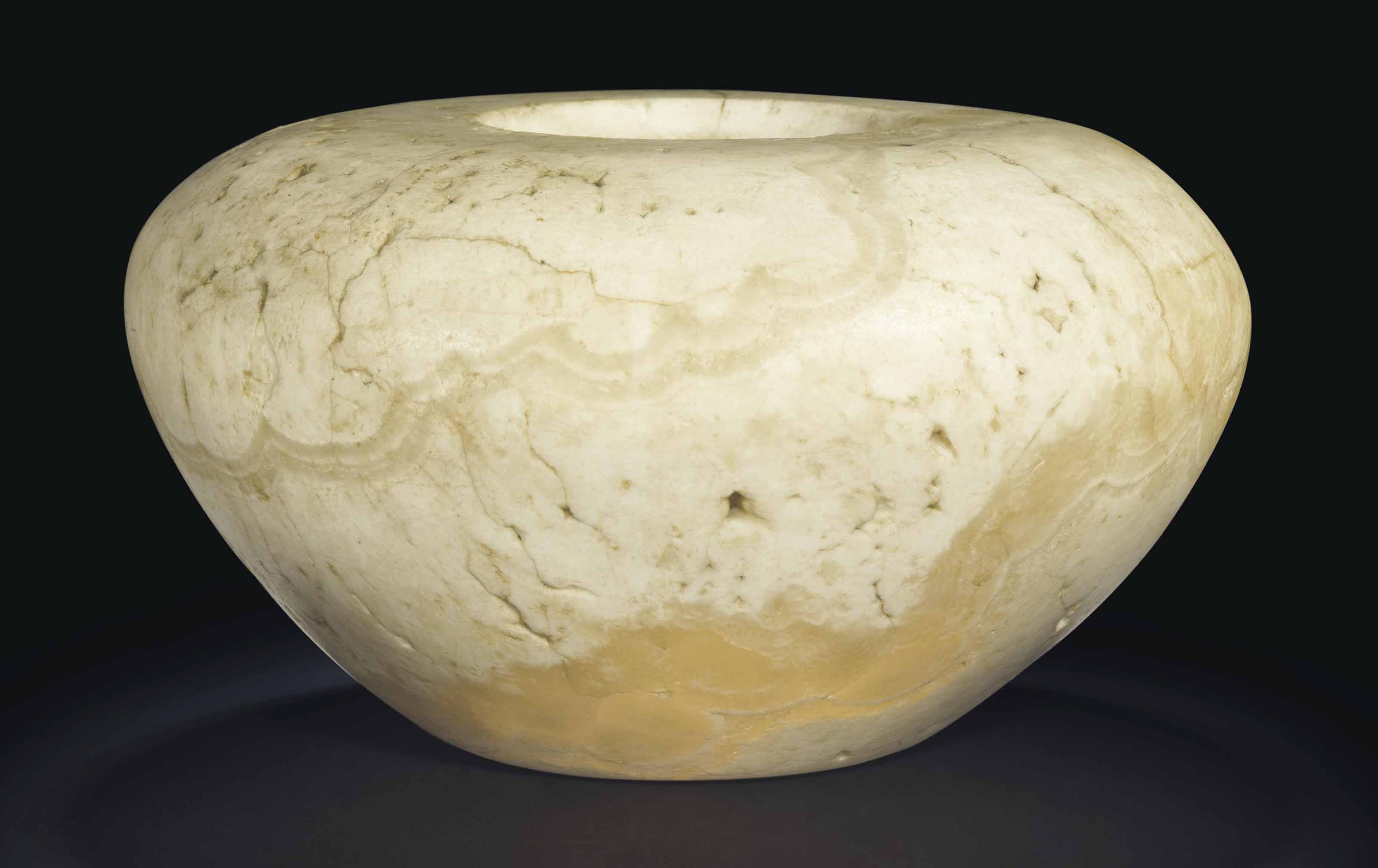 AN EGYPTIAN ALABASTER JAR