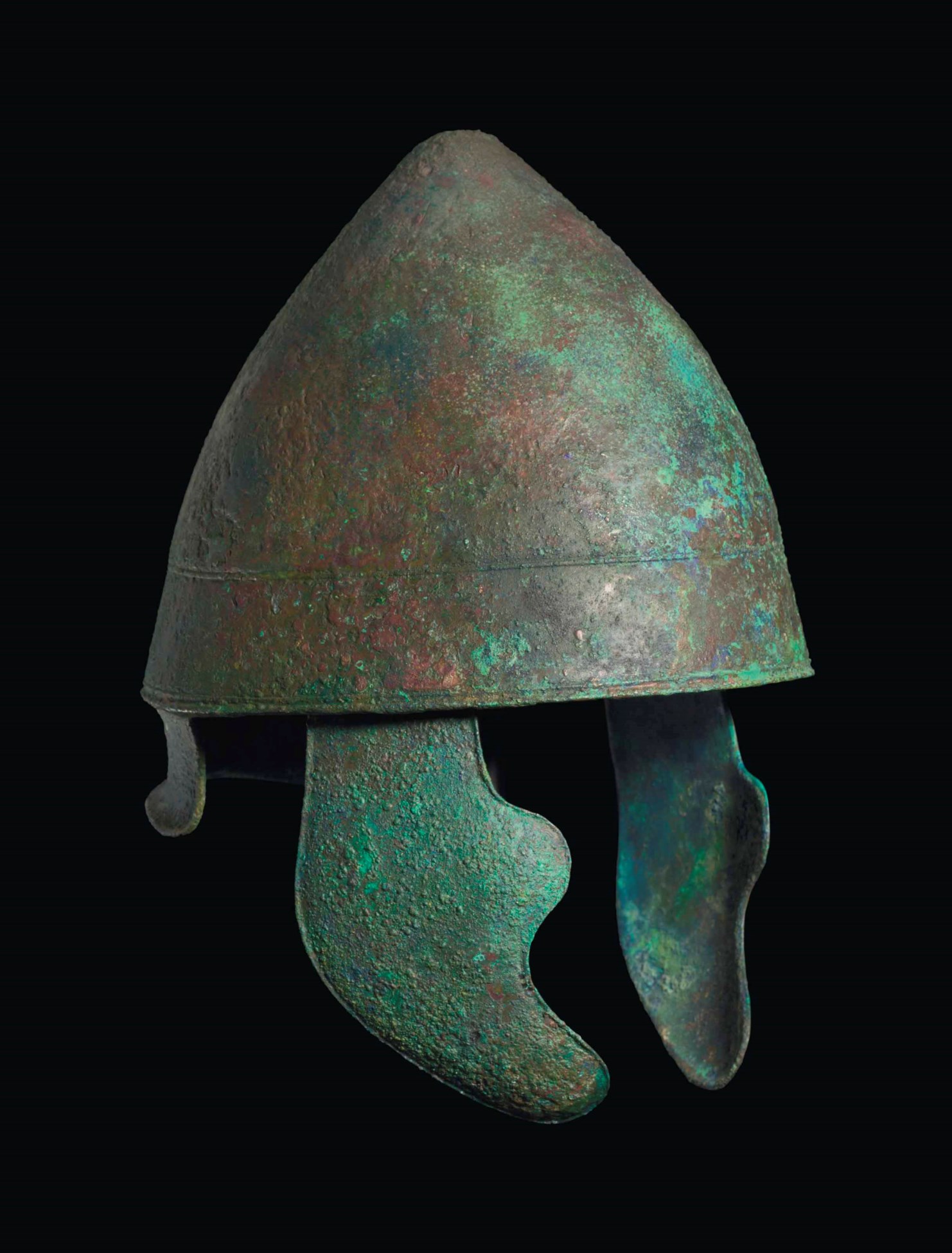 A GREEK BRONZE PILOS HELMET WITH CHEEK PIECES, CLASSICAL PERIOD TO ...