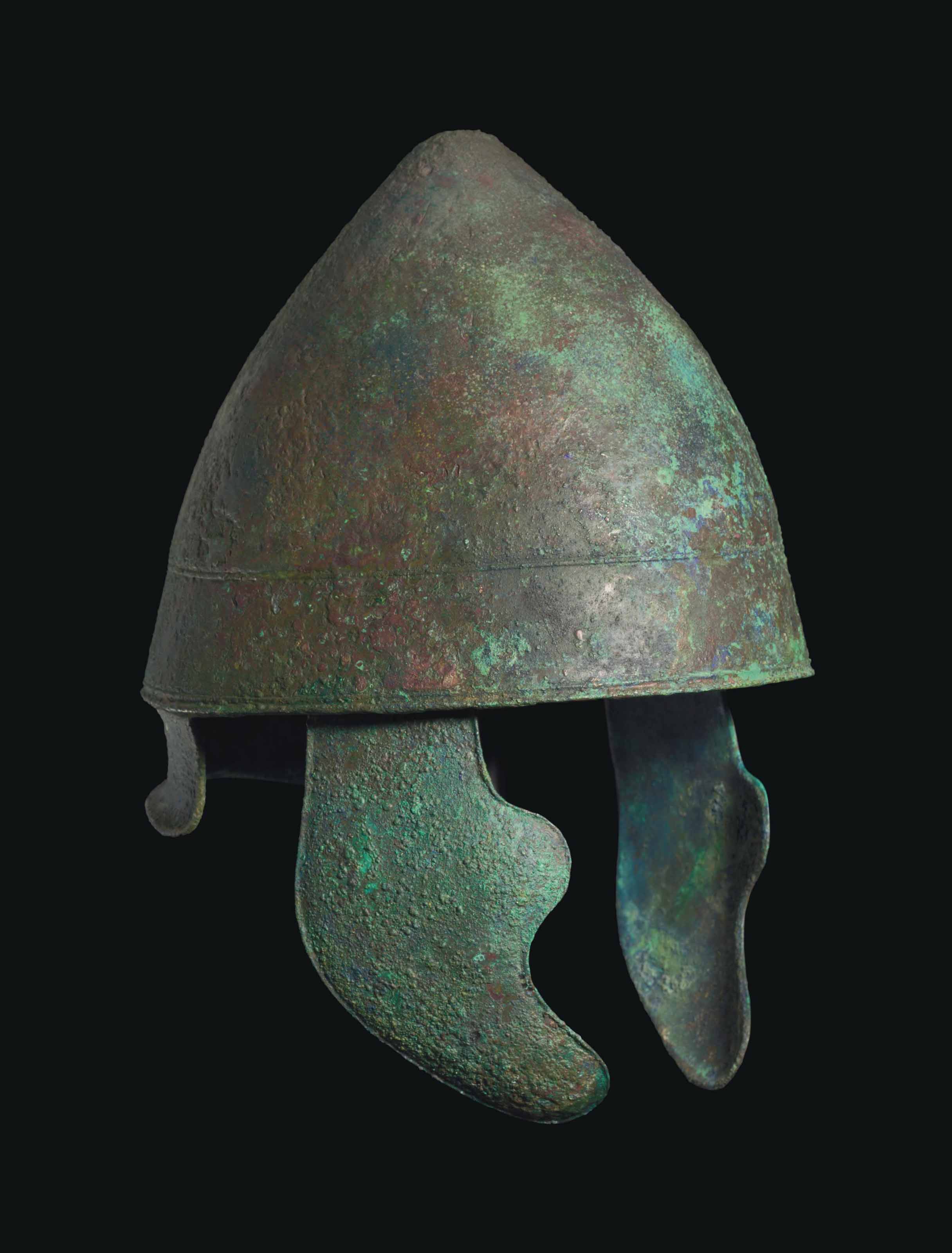 A GREEK BRONZE PILOS HELMET WITH CHEEK PIECES