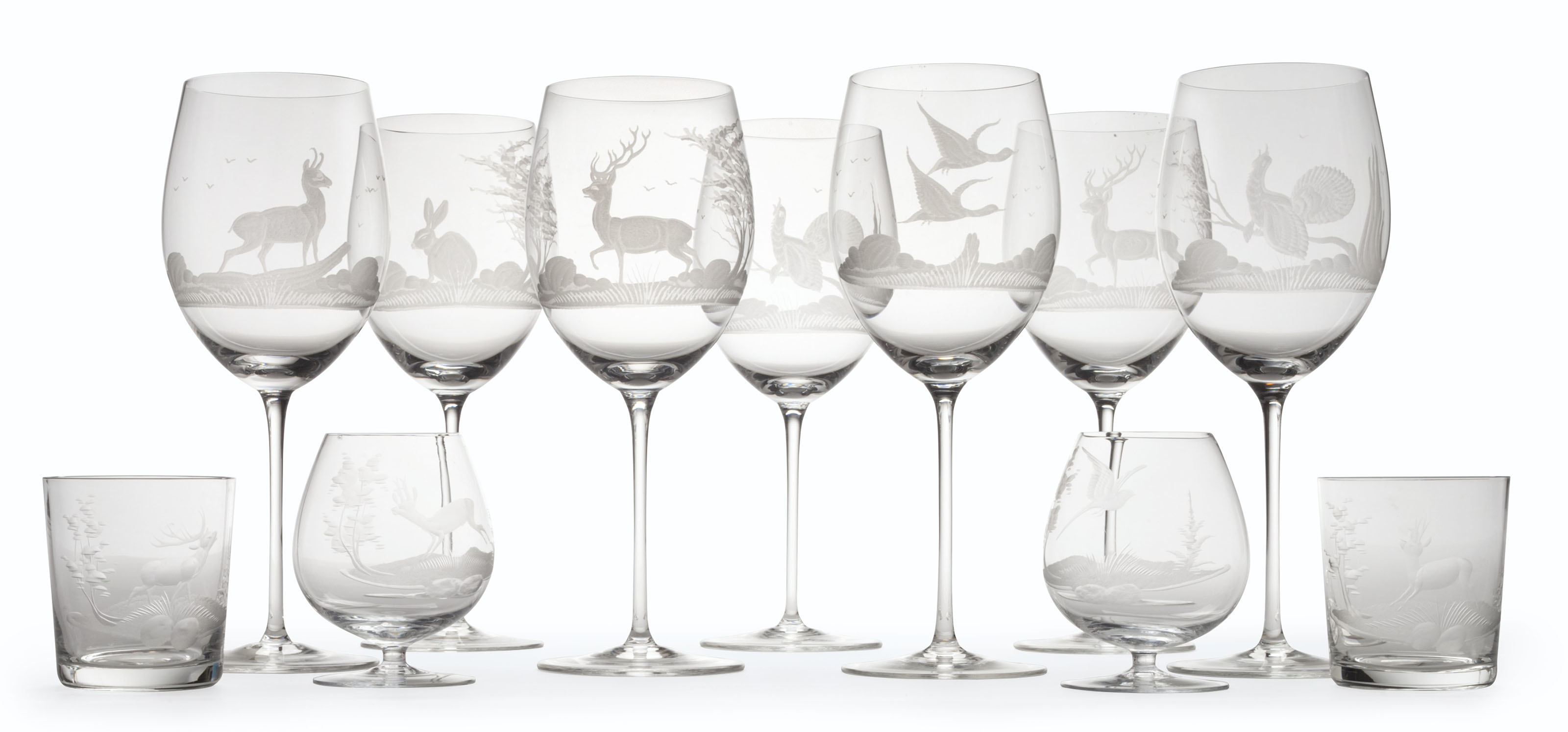 A COLLECTION OF ETCHED CLEAR GLASS DRINK WARE, | Christie’s
