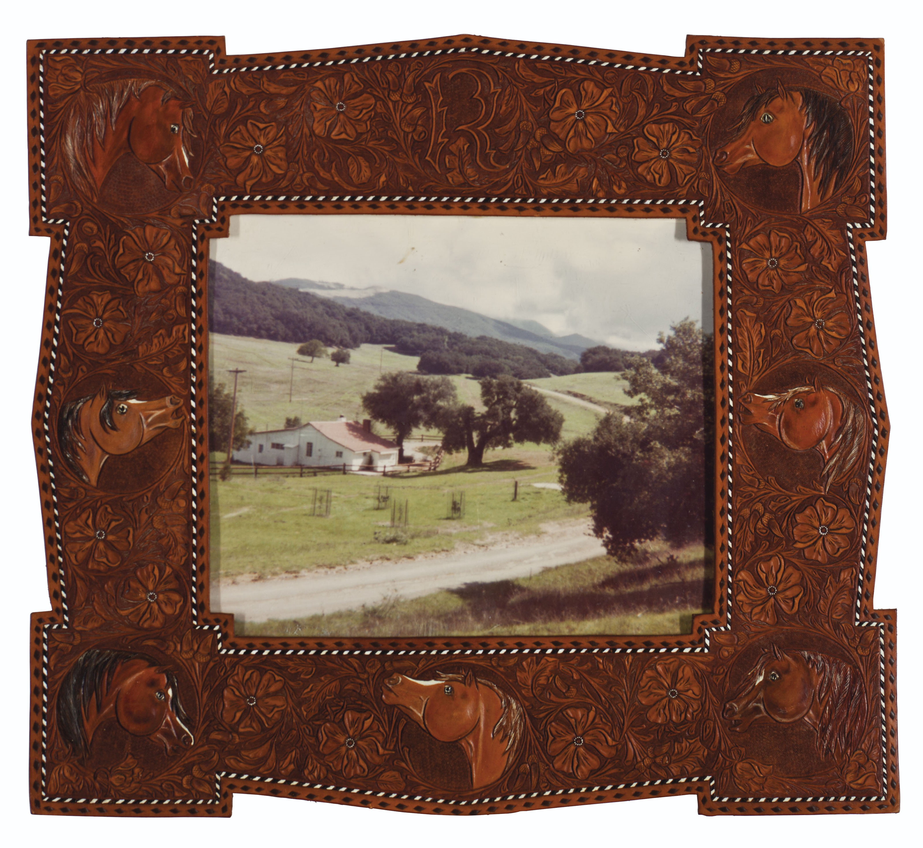 AN ENGRAVED AND EMBOSSED LEATHER FRAME BY SAM SISCO, | Christie’s