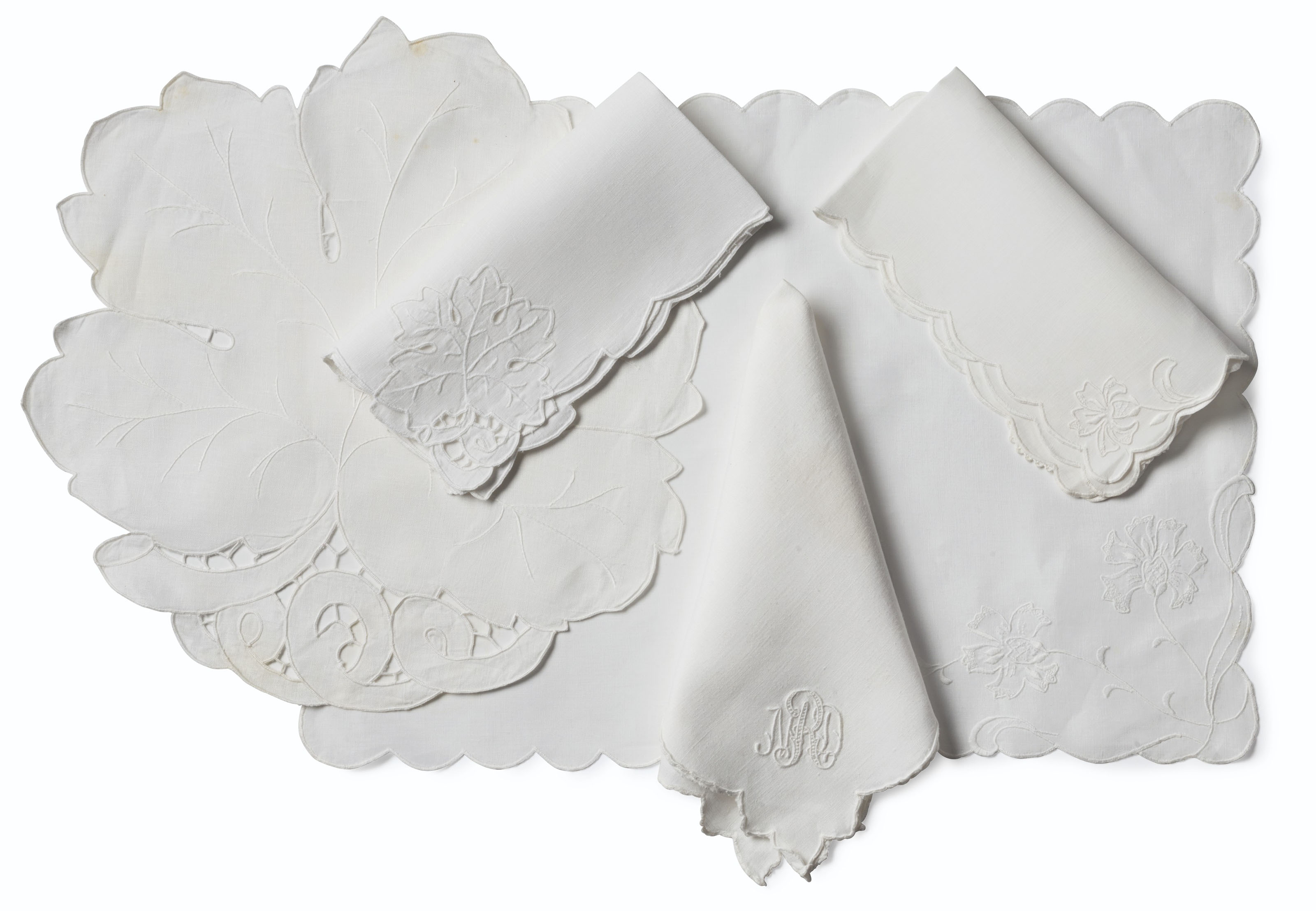 TWO SETS OF EMBROIDERED WHITE TABLE LINENS, | Christie’s