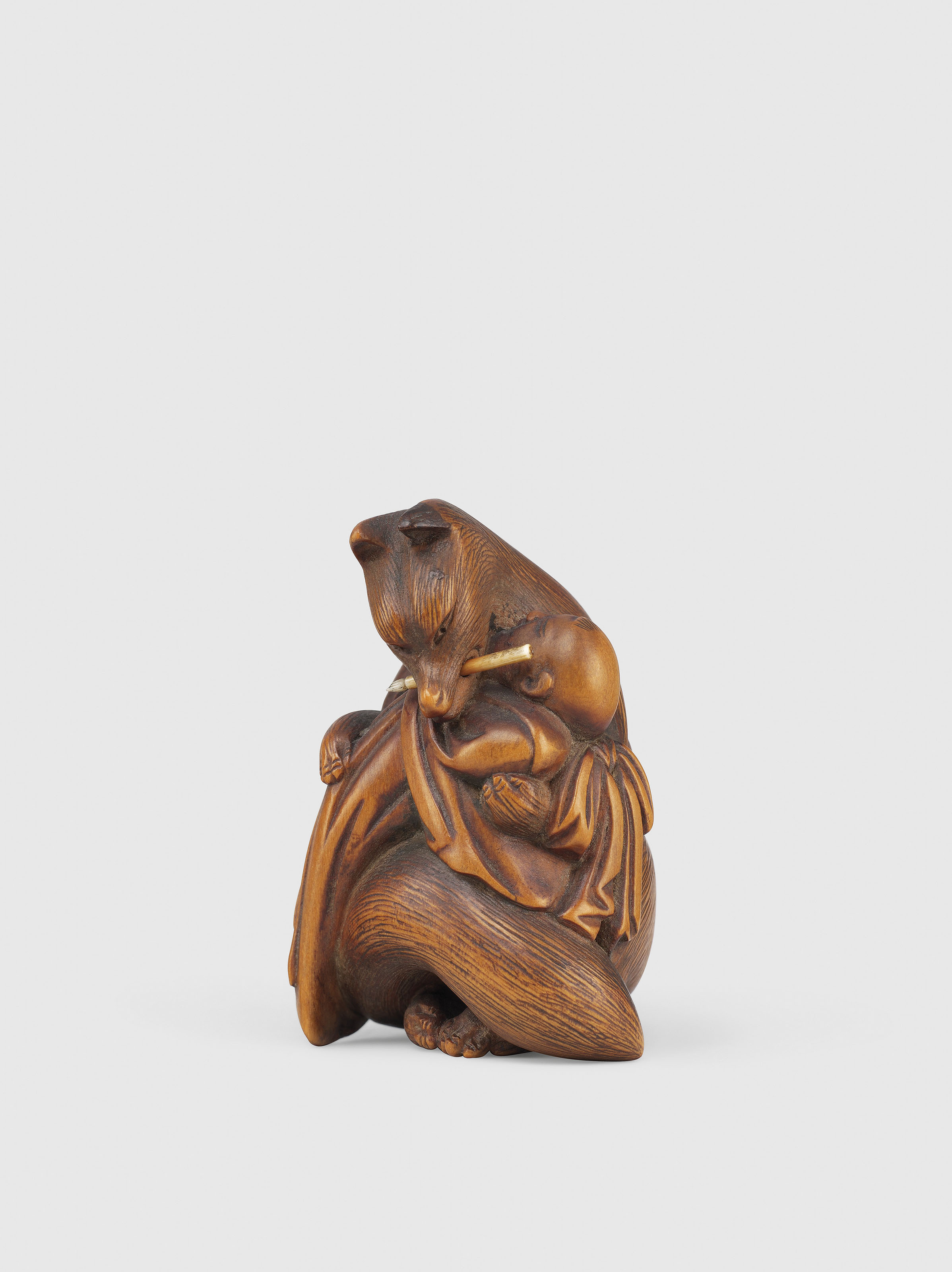 A WOOD NETSUKE OF THE FOX WIFE KUZUNOHA - auctions & price archive