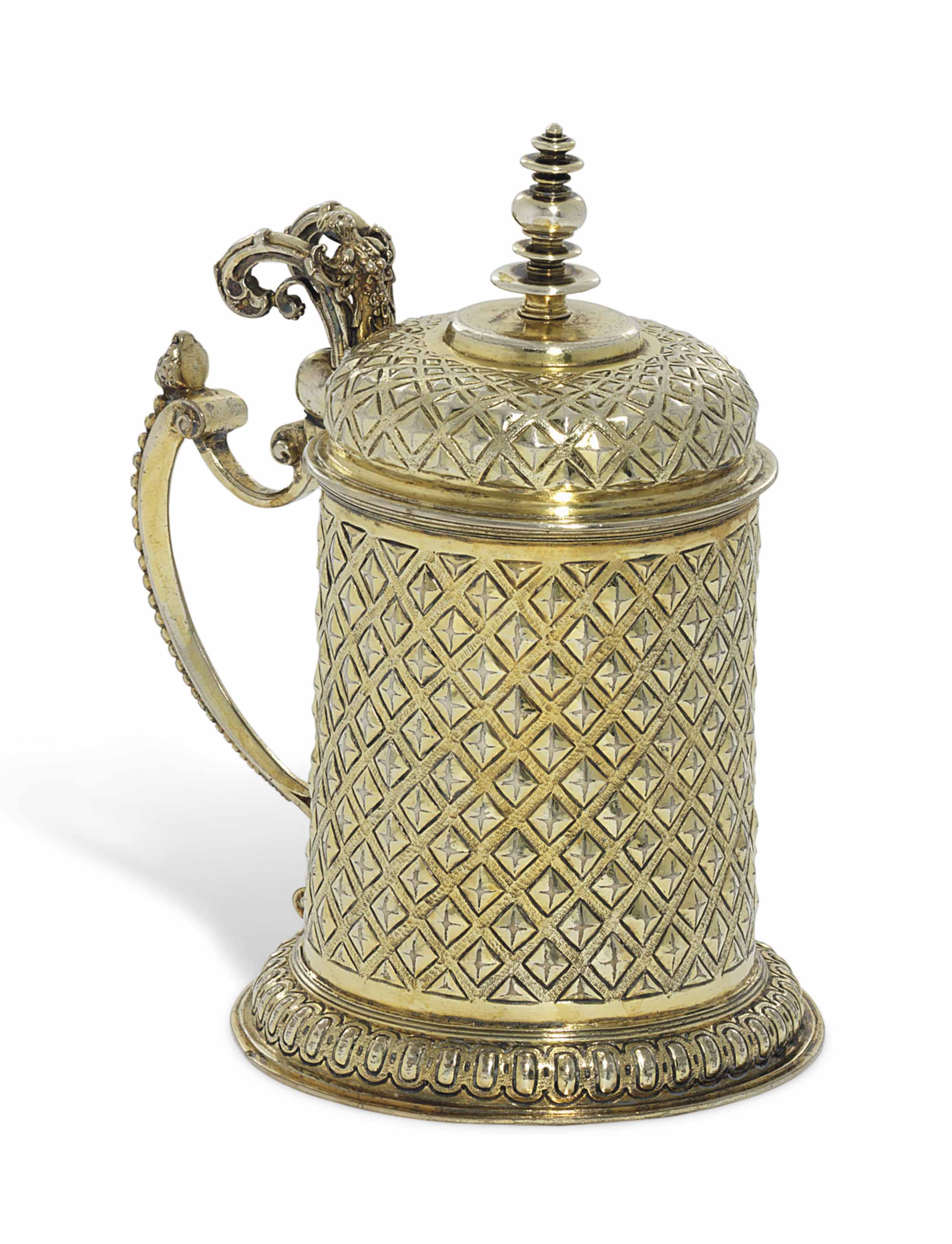 A CONTINENTAL SILVER-GILT-MOUNTED COCONUT-CUP AND COVER, MAKER'S MARK ...