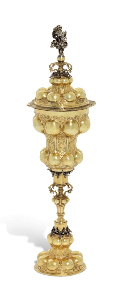 A GERMAN PARCEL-GILT SILVER CUP AND COVER, APPARENTLY UNMARKED, CIRCA ...