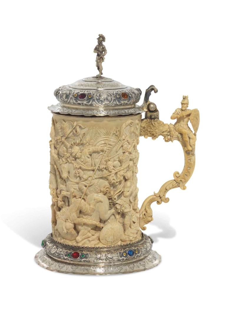 A GERMAN SILVER-GILT-MOUNTED GEM-SET CARVED IVORY TANKARD, APPARENTLY ...