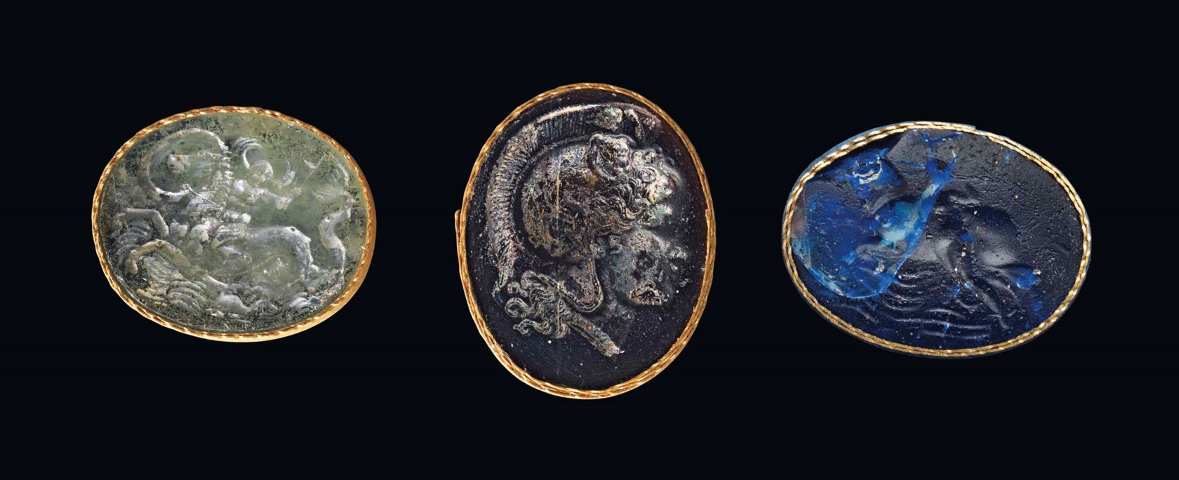 THREE ROMAN GLASS INTAGLIOS