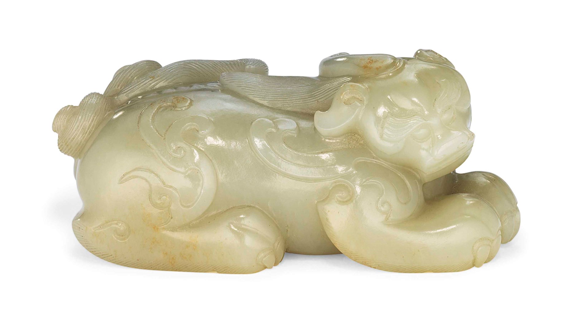 A CHINESE CELADON JADE MYTHICAL HORNED BEAST, 17TH/18TH CENTURY ...