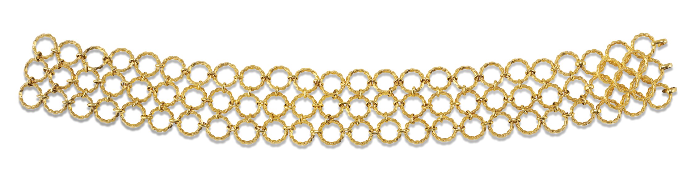 A GILT BELT OF THREE LINKED STRANDS, YVES SAINT LAURENT, CIRCA 1970 ...