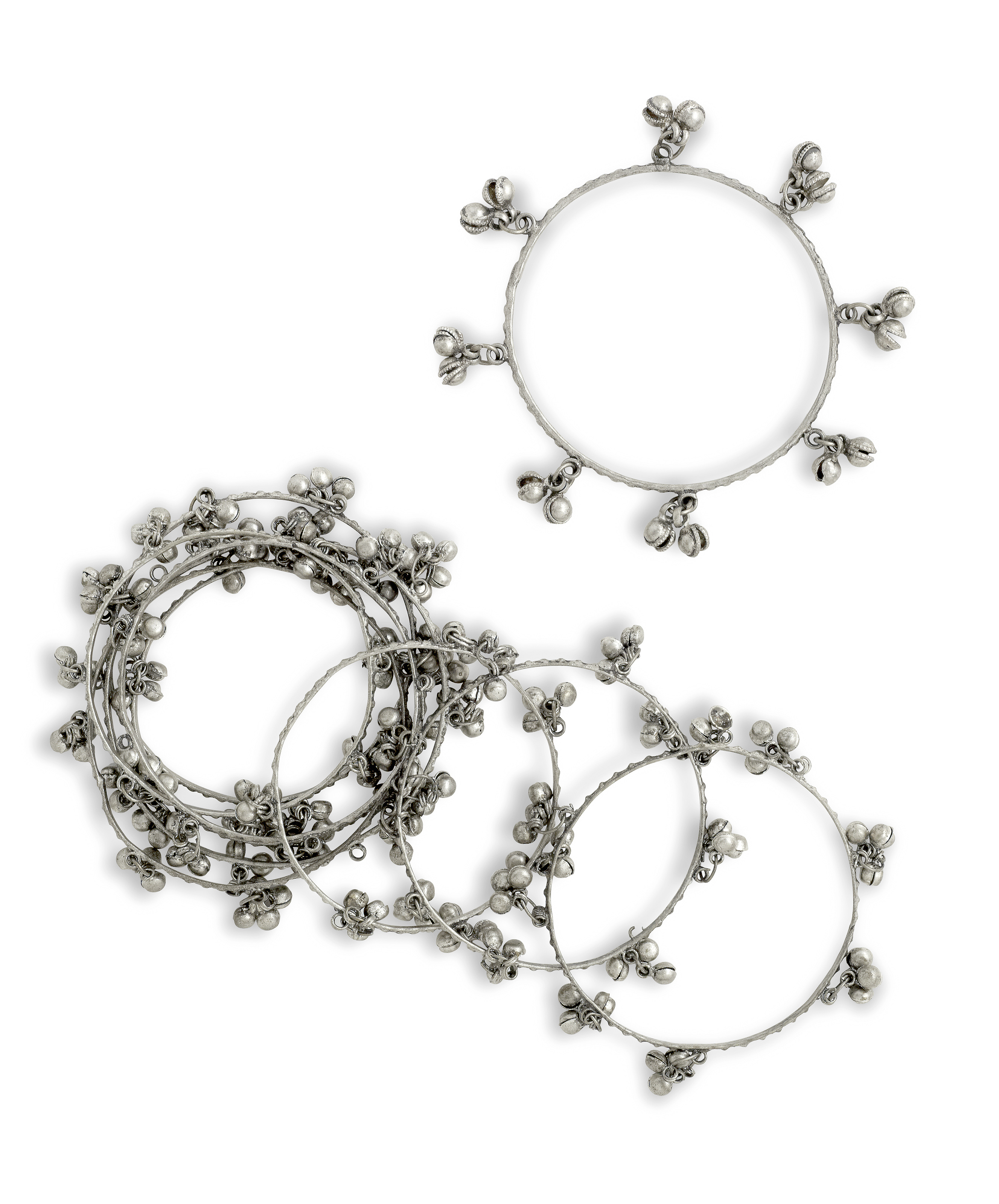 TEN INDIAN PLATED METAL BANGLES, 20TH CENTURY | Christie’s
