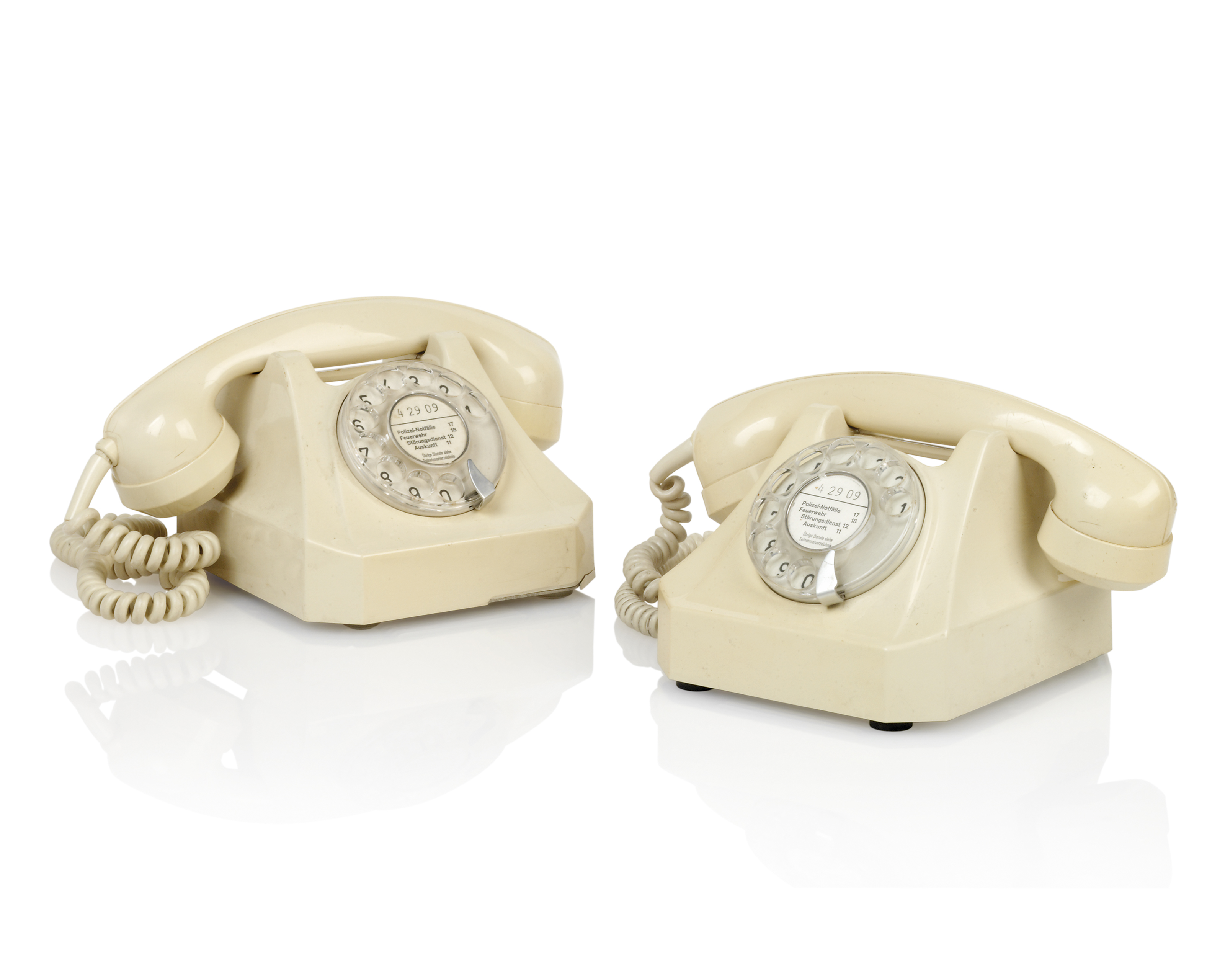 TWO SWISS ‘TFG 3-39.205’ CREAM-PLASTIC ROTARY DIAL TELEPHONES, BY ...