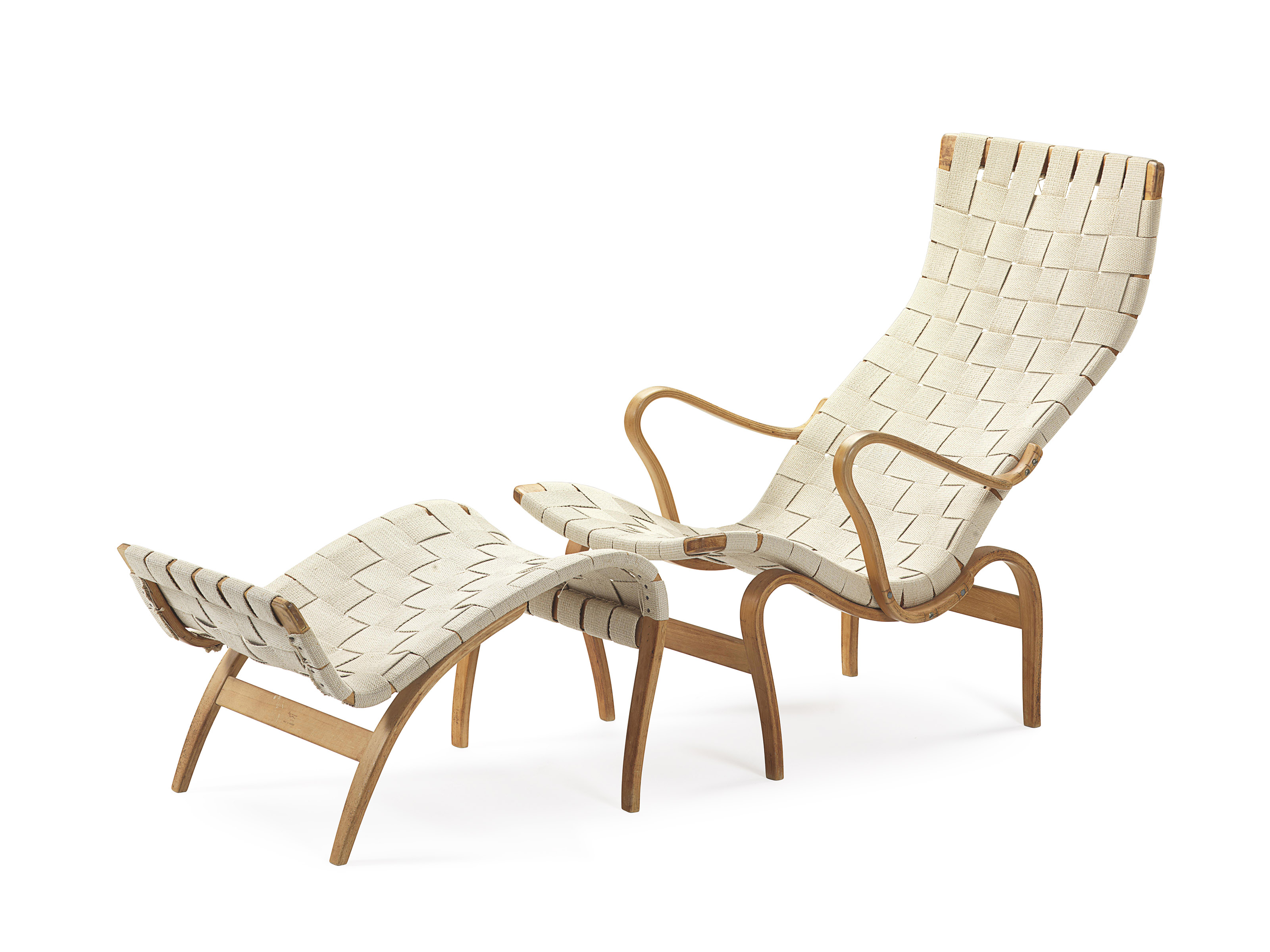 BRUNO MATHSSON (1907 - 1988), A 'PERNILLA' EASY CHAIR AND FOOTSTOOL ...