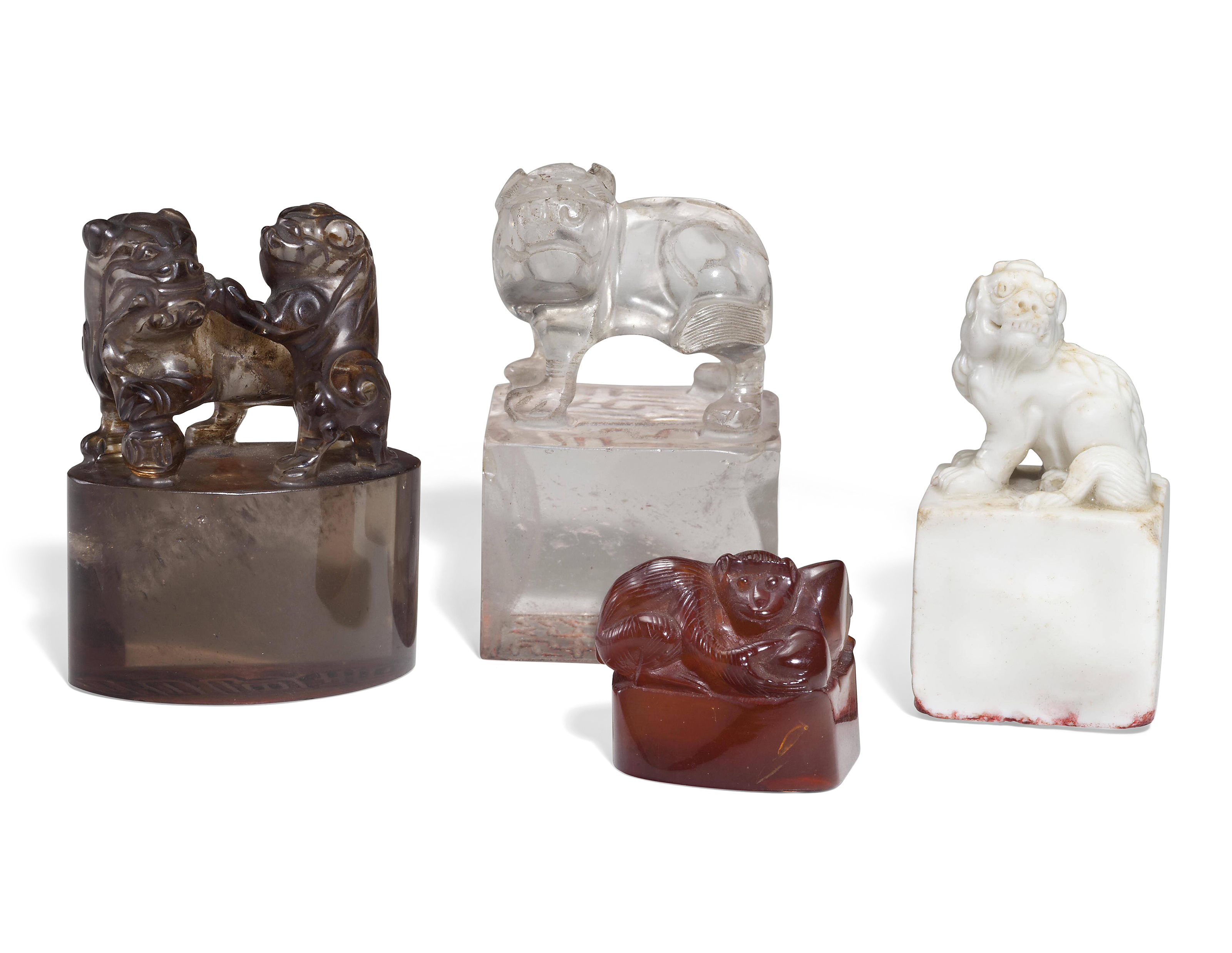 TWO ROCK CRYSTAL SEALS, ONE AMBER SEAL AND A WHITE-GLAZED PORCELAIN ...