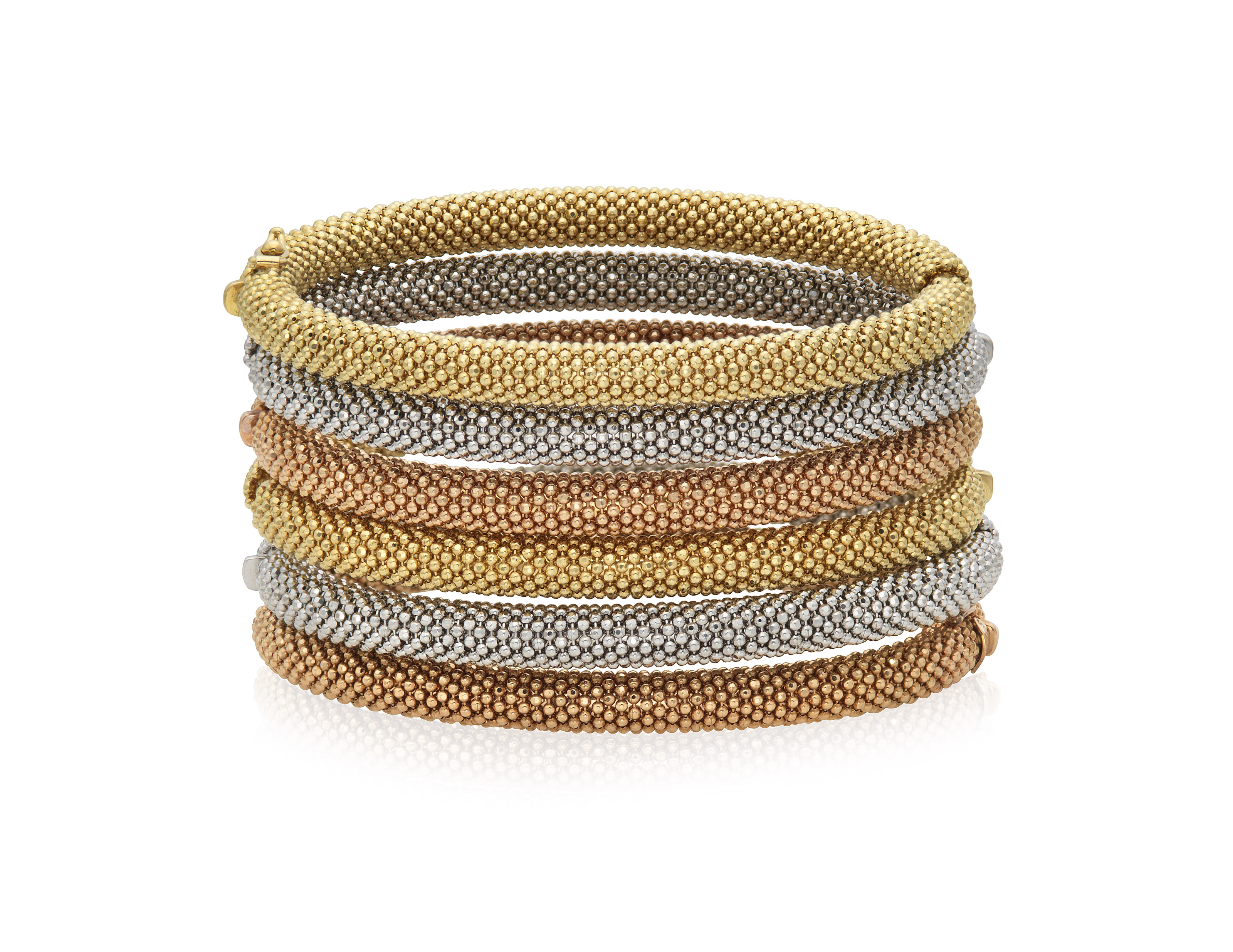 GROUP OF TEXTURED GOLD BANGLE BRACELETS, | Christie’s