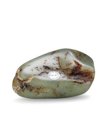 A GREEN AND RUSSET JADE PEBBLE, | Christie’s