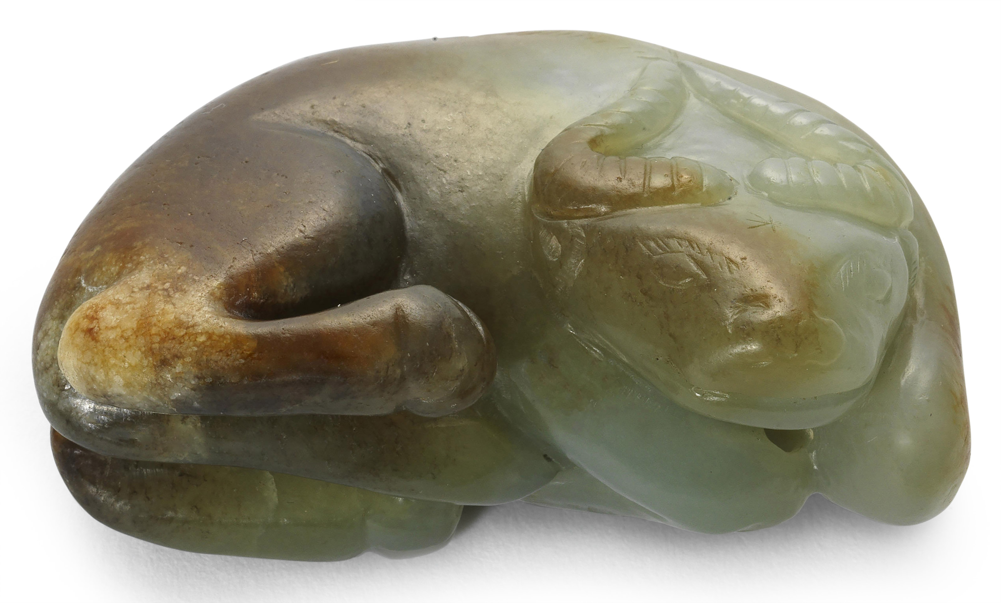 A CELADON AND RUSSET JADE WATER BUFFALO, 17TH CENTURY | Christie’s