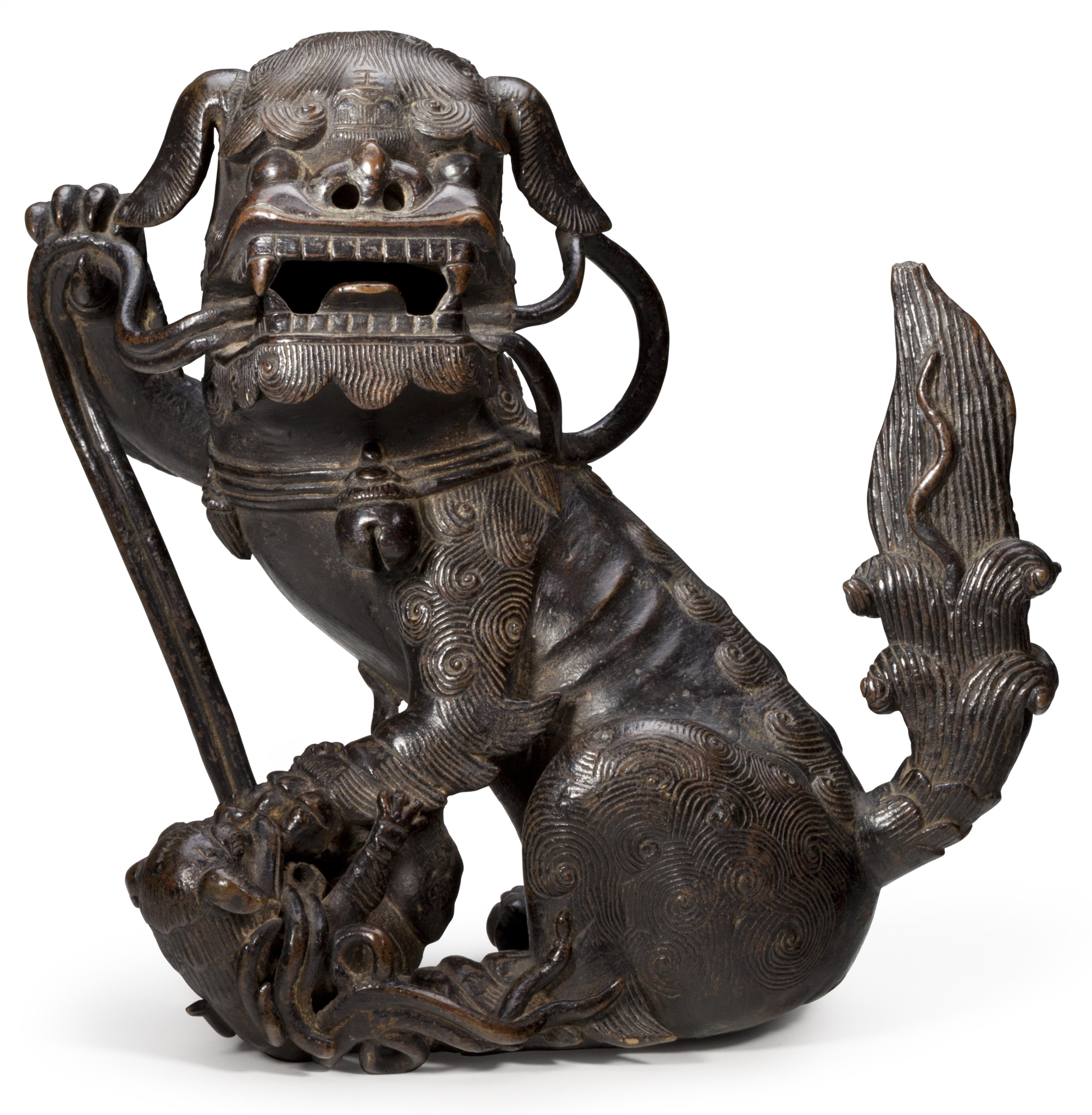 A BRONZE FIGURE OF A BUDDHIST LION, LATE MING-EARLY QING DYNASTY ...