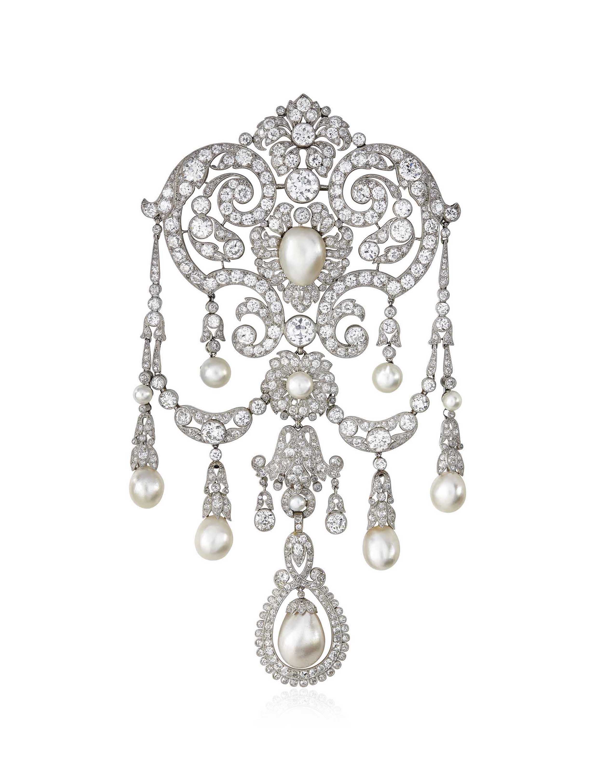 A BELLE ÉPOQUE NATURAL PEARL AND DIAMOND STOMACHER BROOCH