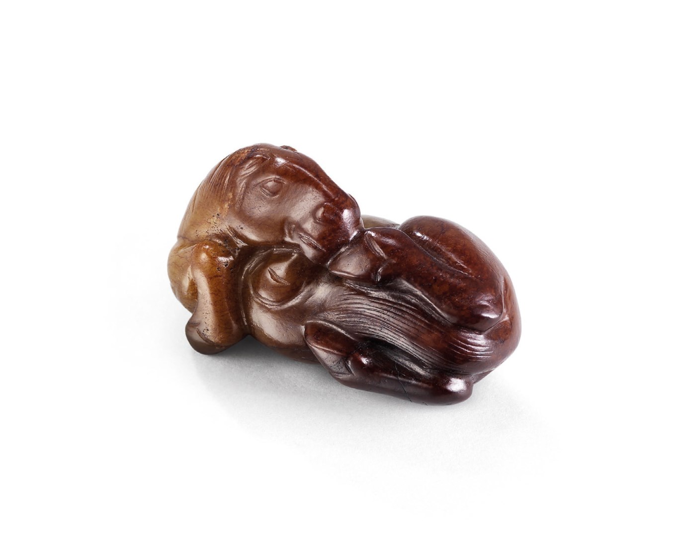 A RUSSET JADE RECUMBENT HORSE, MING DYNASTY (1368-1644) | Christie's