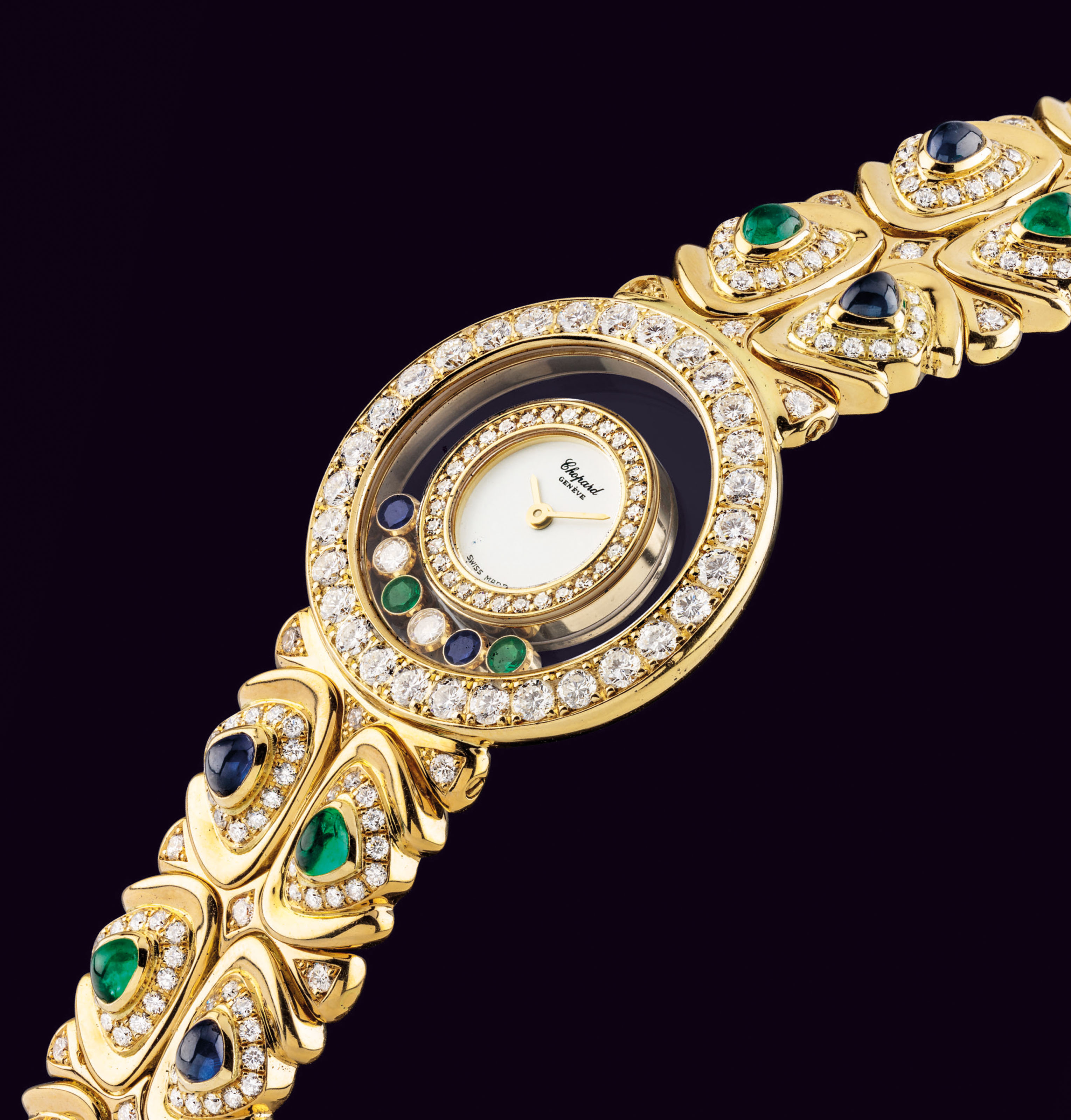CHOPARD. A LADY’S FINE AND RARE 18K GOLD AND GEM-SET BRACELET WATCH