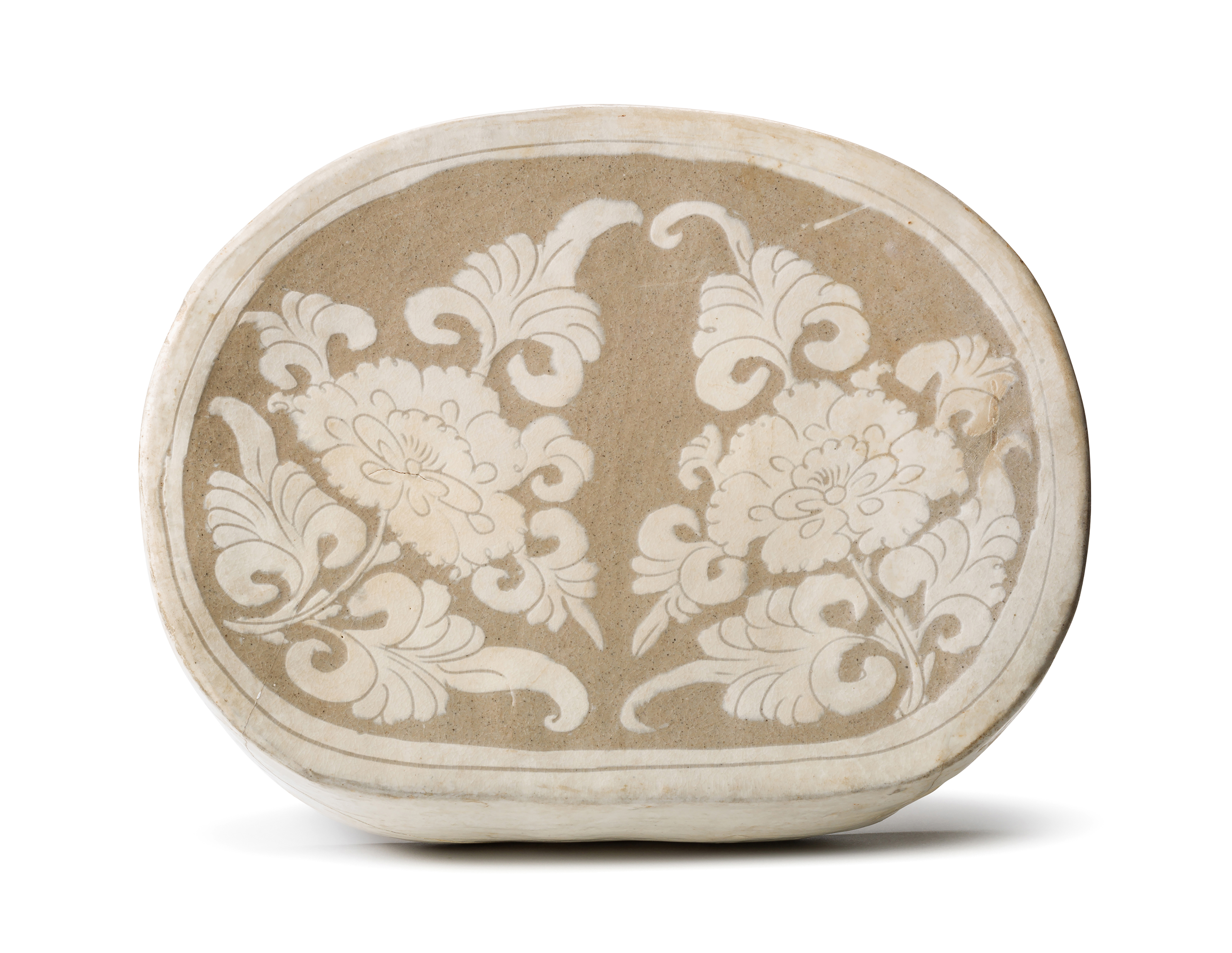 A CIZHOU WHITE-GLAZED SGRAFFITO ‘PEONY’ PILLOW, NORTHERN SONG DYNASTY ...