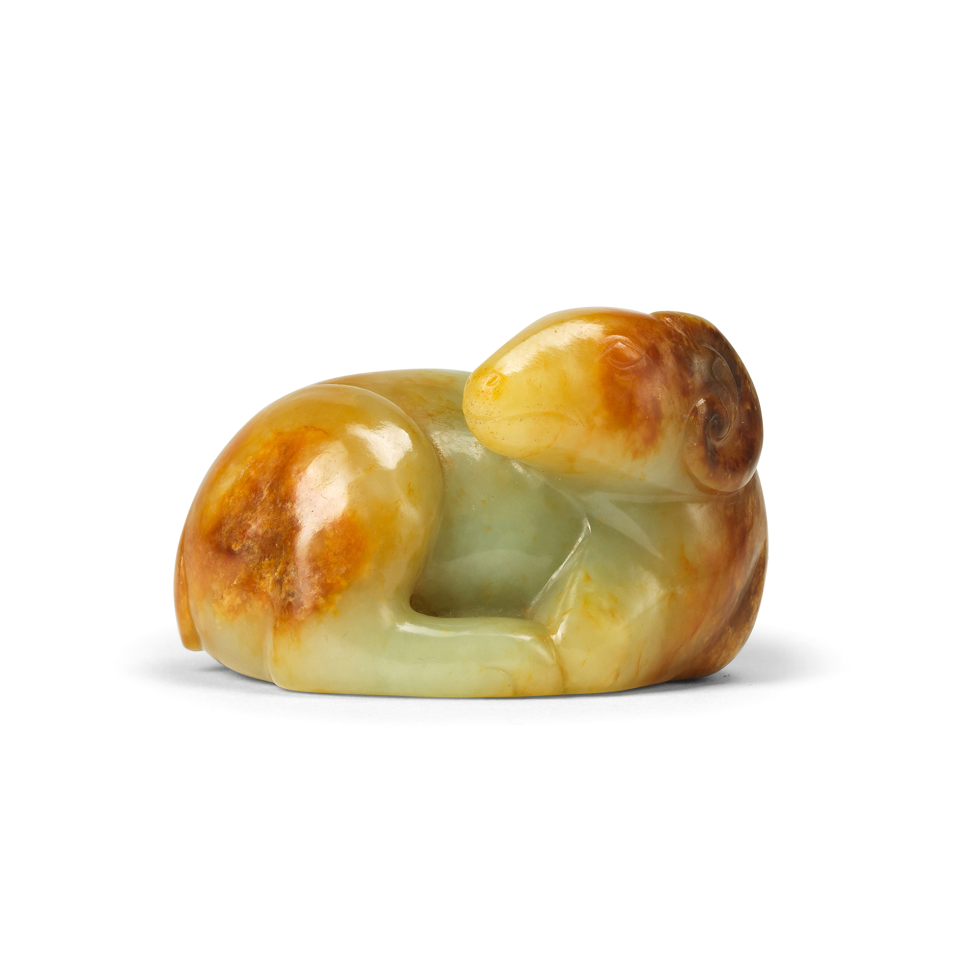 A CELADON AND RUSSET JADE CARVING OF A RAM, MING DYNASTY (1368-1644 ...