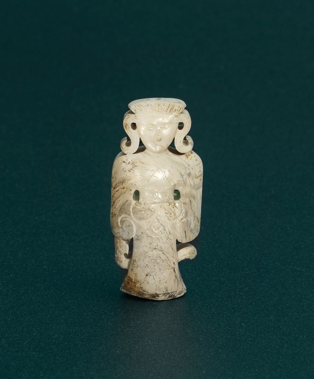 A JADE STANDING FIGURE, LATE WARRING STATES PERIOD TO EARLY WESTERN HAN ...