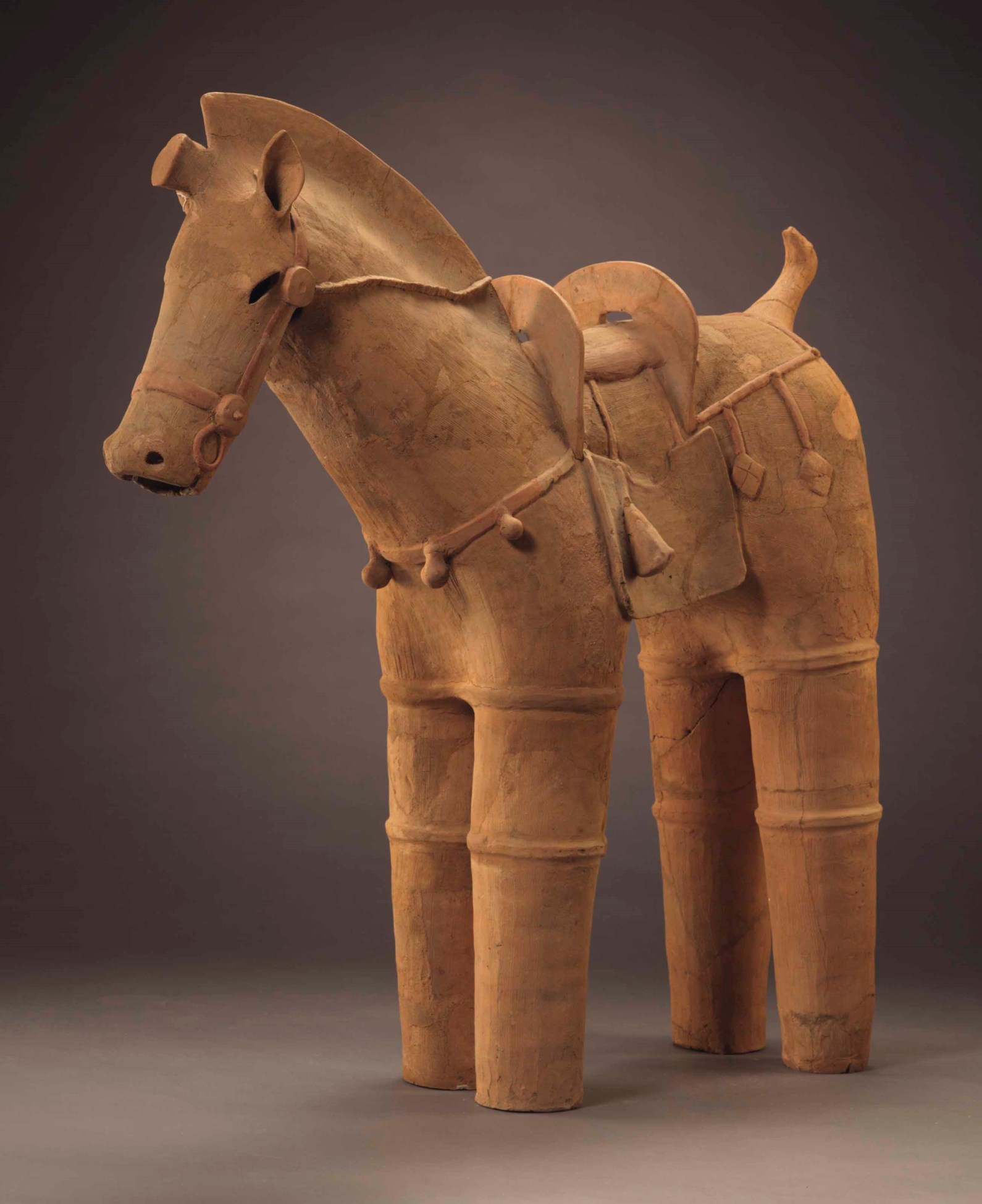 A large haniwa earthenware figure of a life-like horse, Late Kofun ...