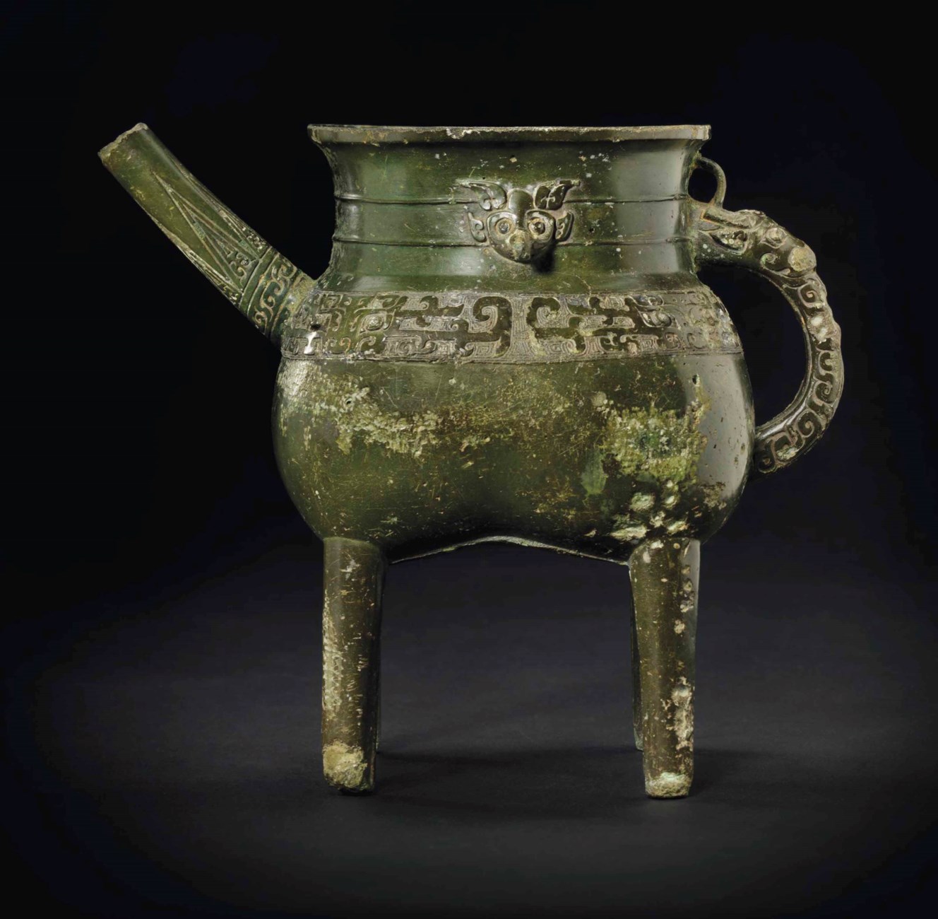 A BRONZE RITUAL WINE VESSEL, HE, LATE SHANG-EARLY WESTERN ZHOU DYNASTY ...