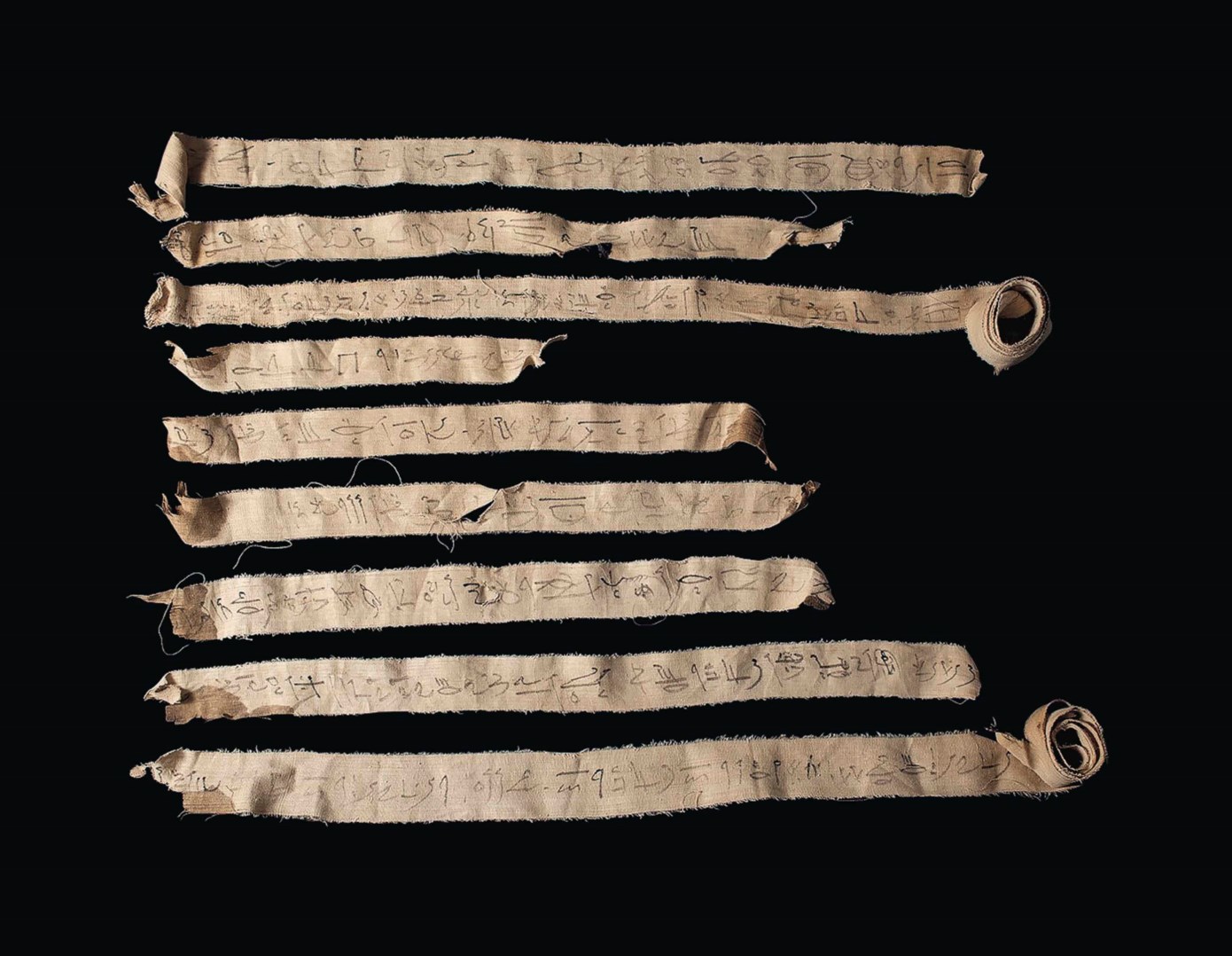 NINE EGYPTIAN LINEN MUMMY BANDAGES FOR HARPAKHEM, LATE PERIOD TO ROMAN ...