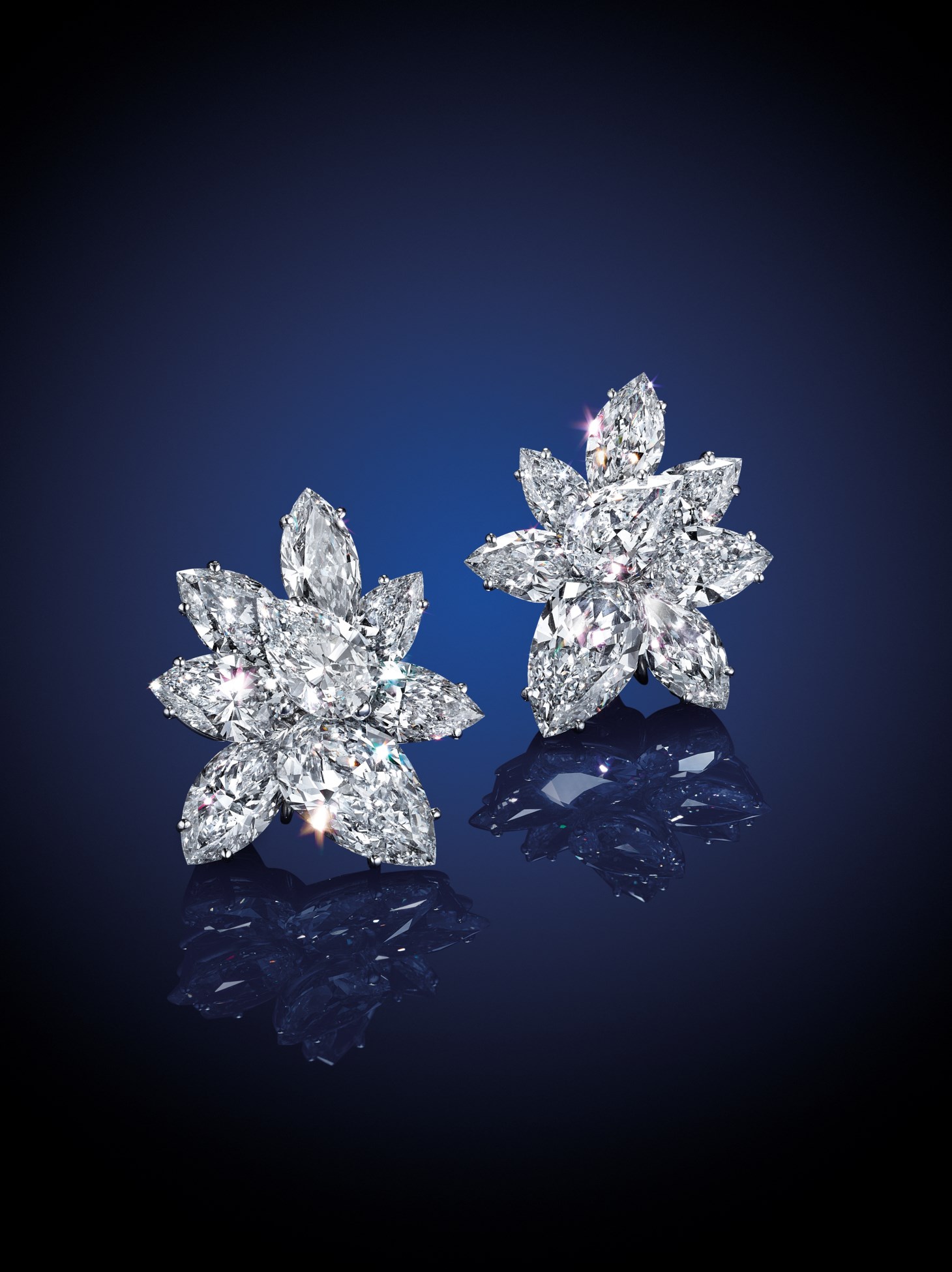A PAIR OF DIAMOND CLUSTER EAR CLIPS | Christie's