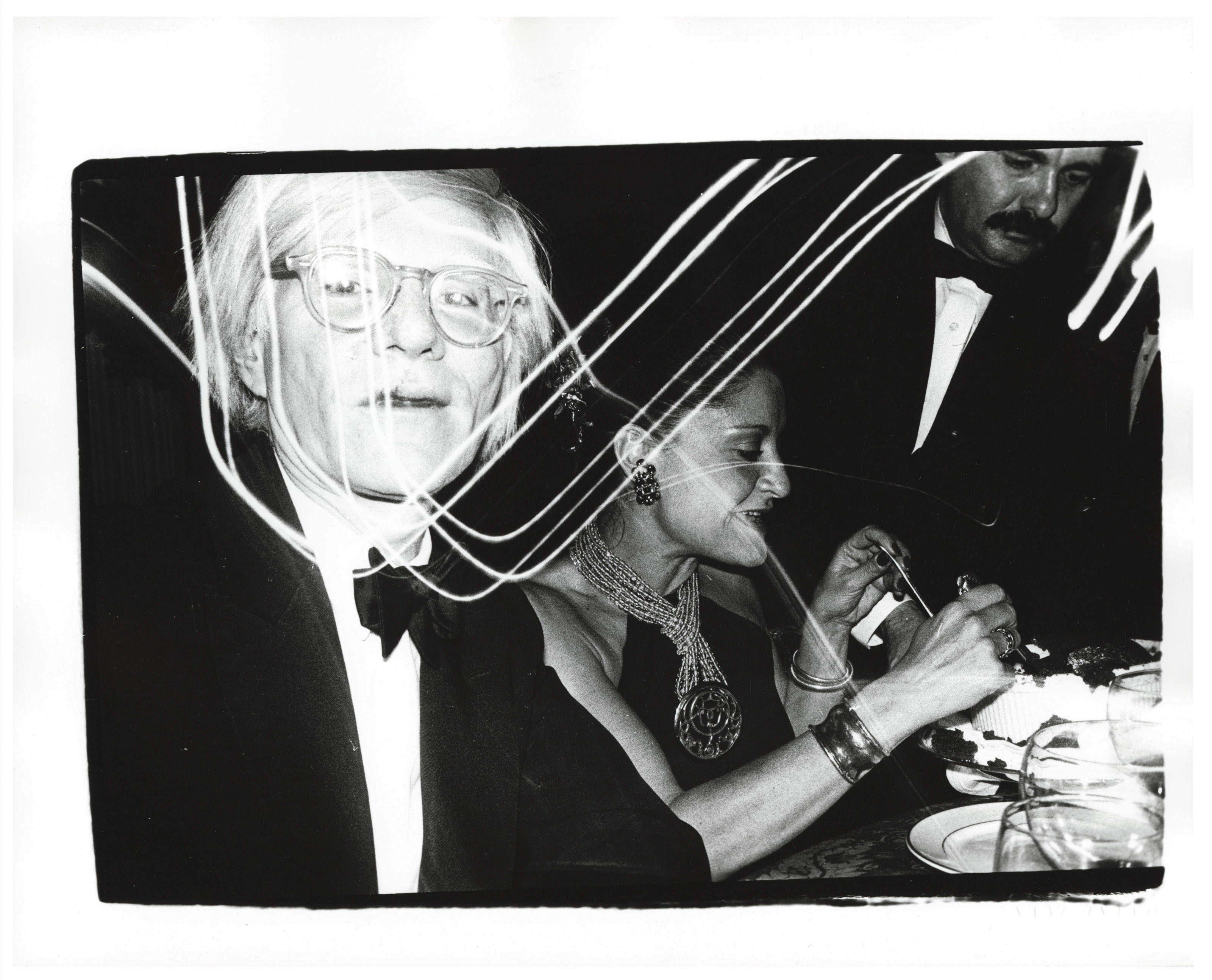 ANDY WARHOL (1928-1987), Andy Warhol and Friend at Dinner Party ...