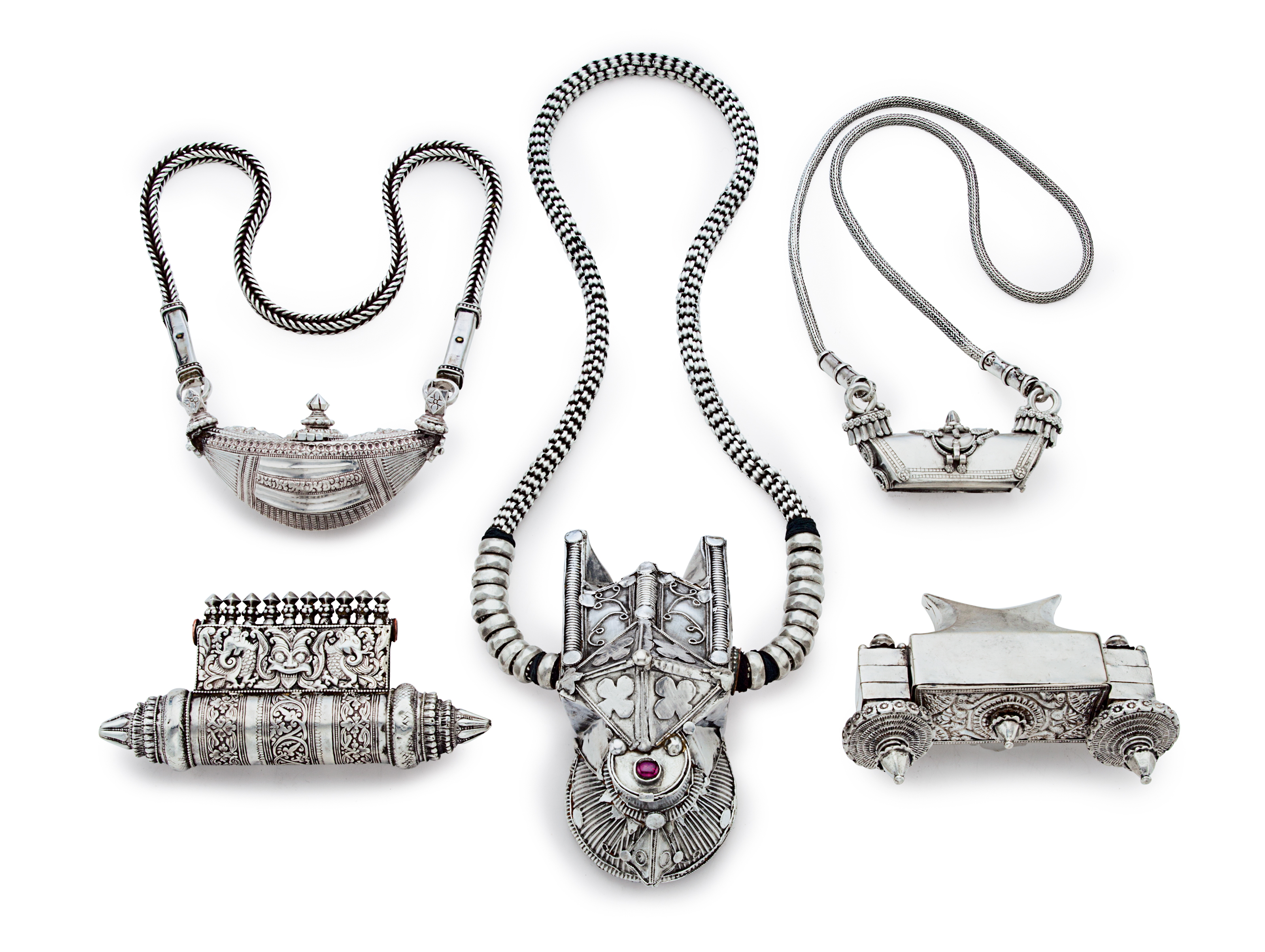 FIVE SILVER AND SILVERED-METAL TALISMANS, THREE ON CHAINS, INDIA, 19TH ...