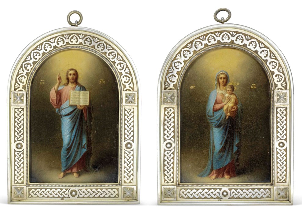 A PAIR OF SILVER-GILT ICONS DEPICTING THE MOTHER OF GOD AND CHRIST ...
