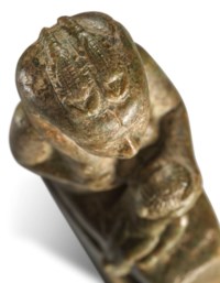 AN EGYPTIAN PERIDOTITE FIGURE OF HEDEDET AND HORUS