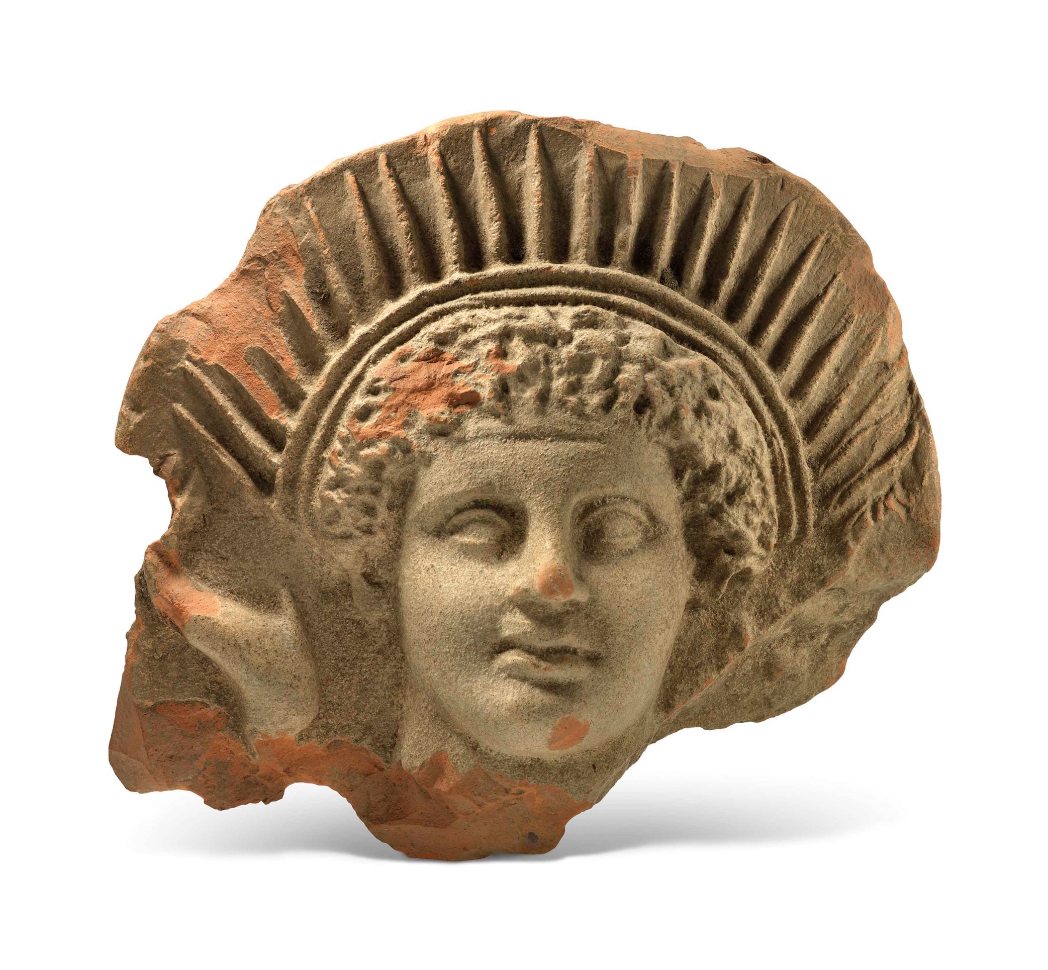 A GREEK TERRACOTTA ANTEFIX, CLASSICAL PERIOD, CIRCA 4TH CENTURY B.C ...