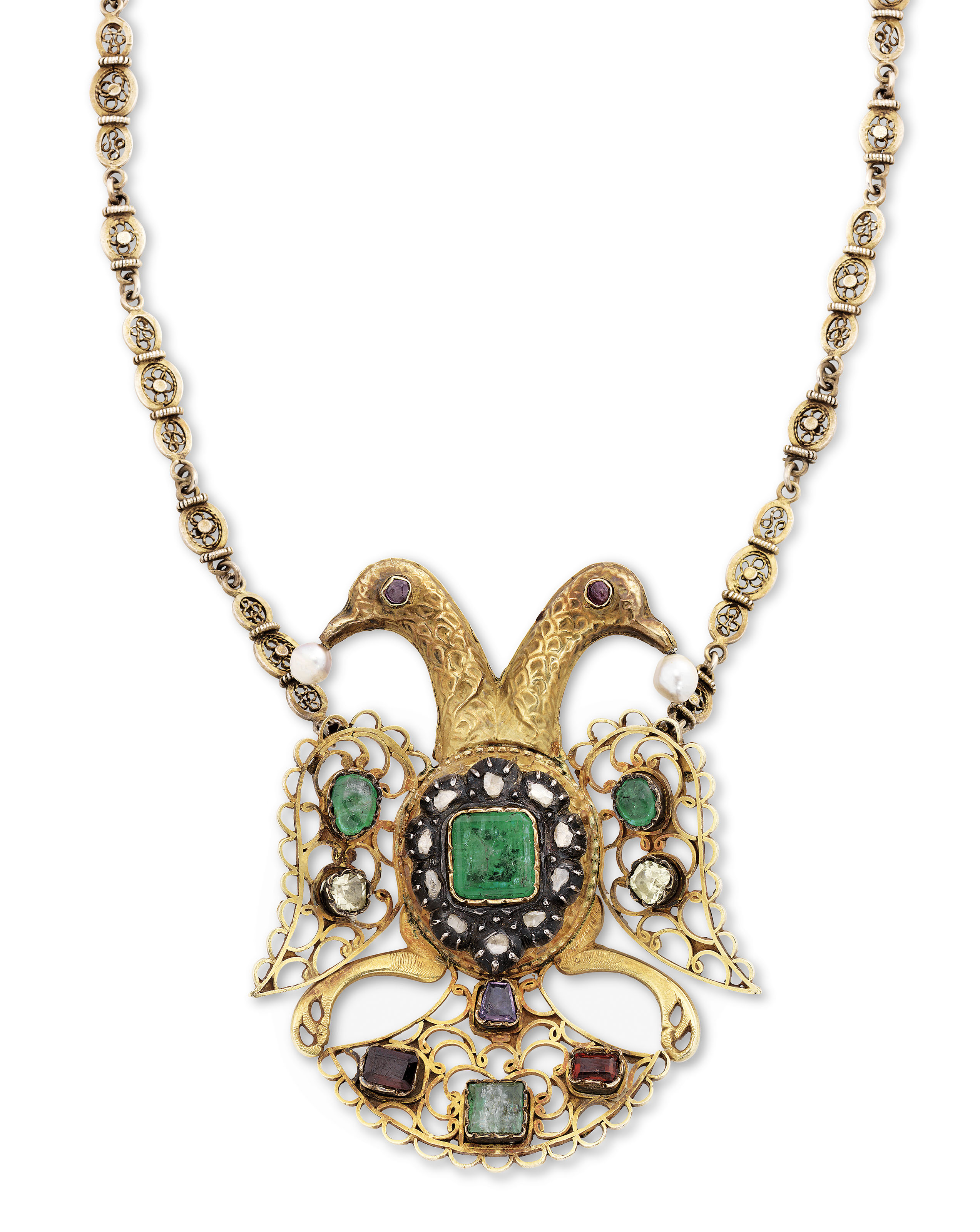 A MOROCCAN DIAMOND AND EMERALD-SET GOLD DOUBLE-HEADED EAGLE