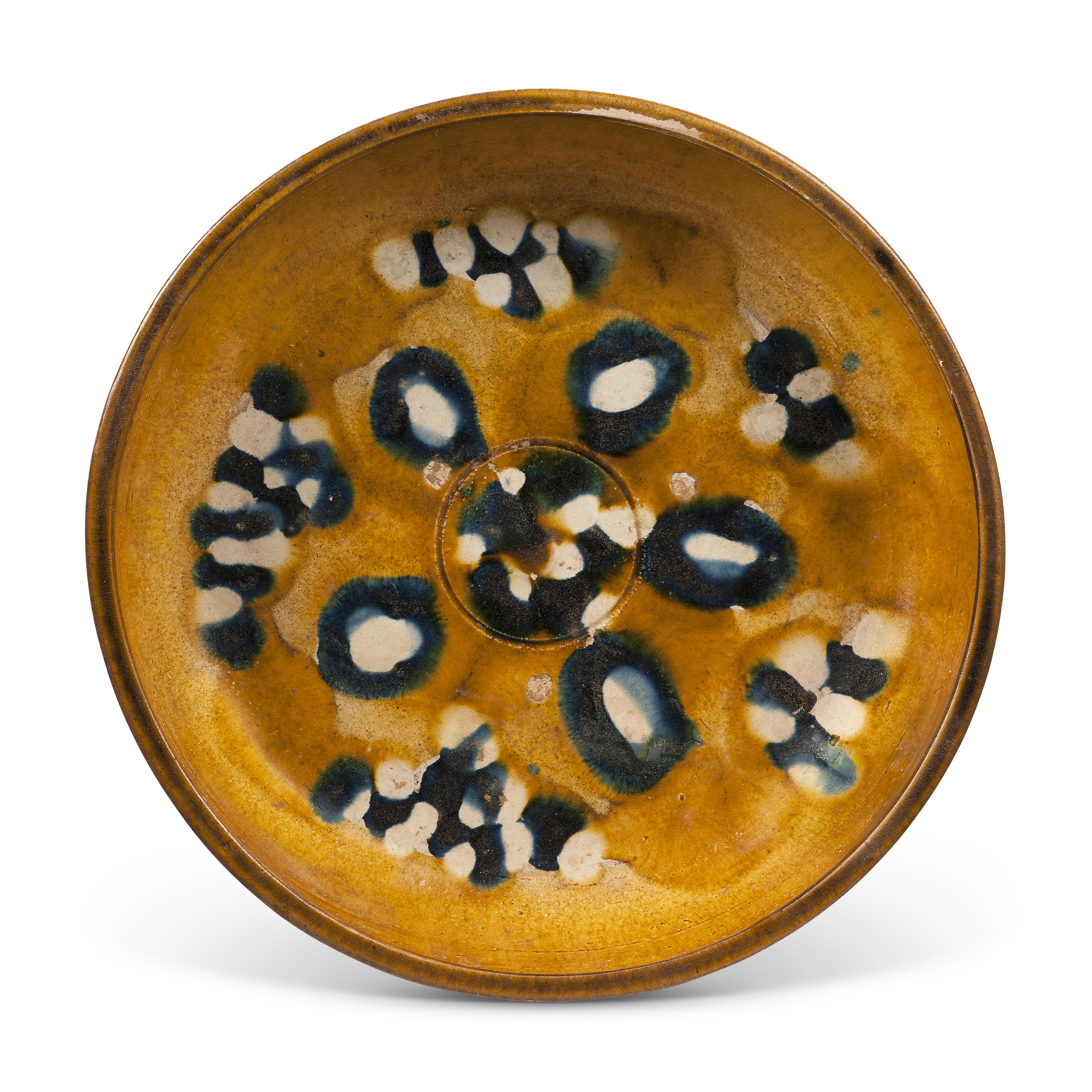 A BLUE, AMBER AND CREAM-GLAZED POTTERY DISH, LIAO DYNASTY (907-1125 AD ...