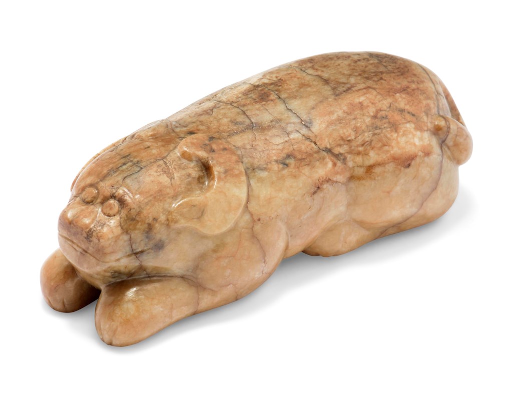 A YELLOWISH-BEIGE JADE CARVING OF A MYTHICAL BEAST, 17TH CENTURY ...