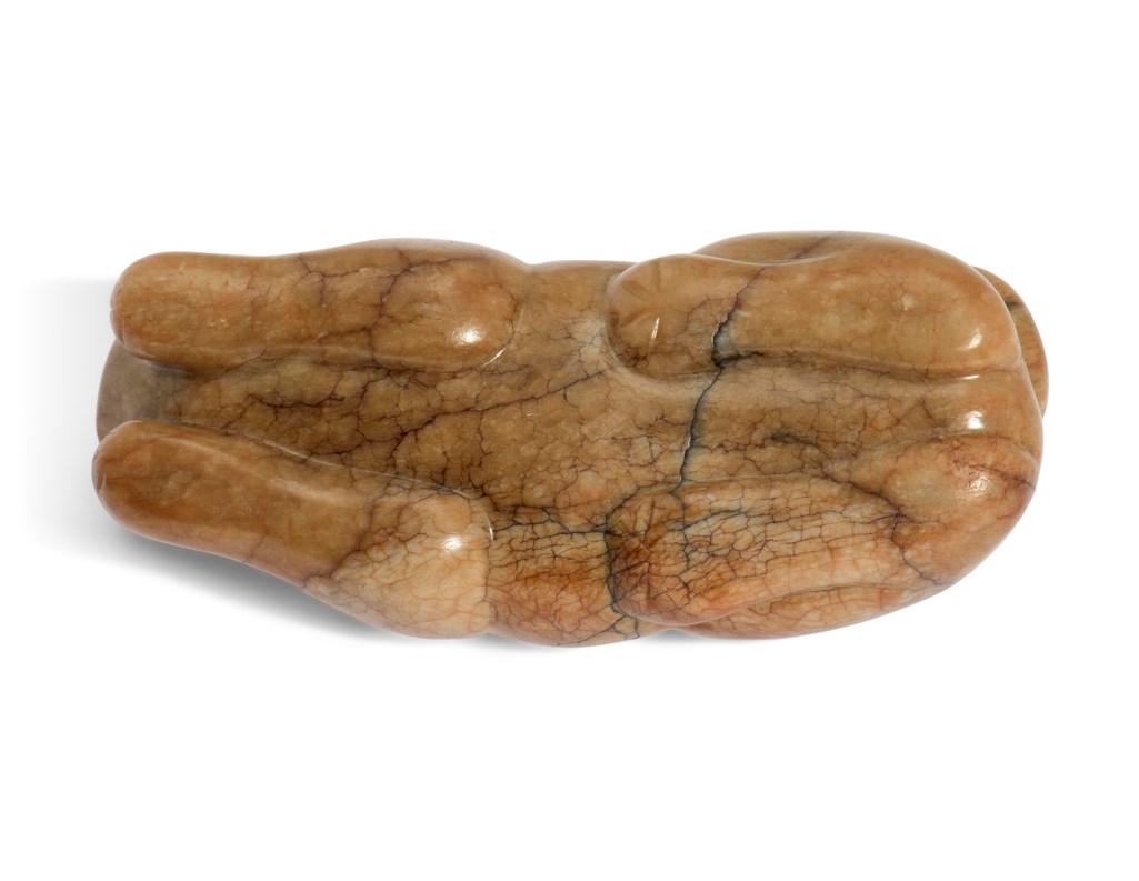 A YELLOWISH-BEIGE JADE CARVING OF A MYTHICAL BEAST, 17TH CENTURY ...