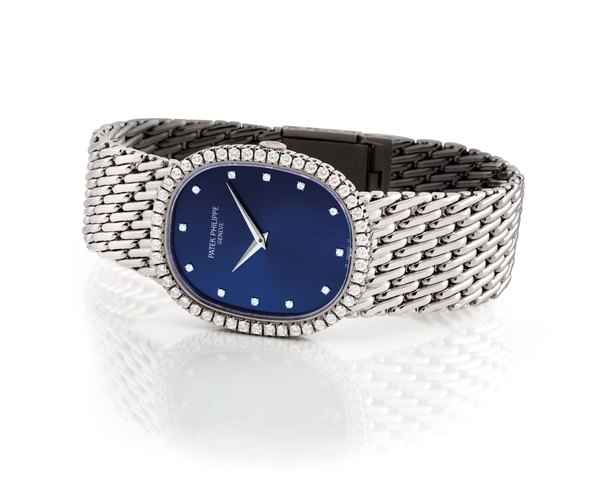 PATEK PHILIPPE. A FINE 18K WHITE GOLD AND DIAMOND-SET OVAL-SHAPED ...