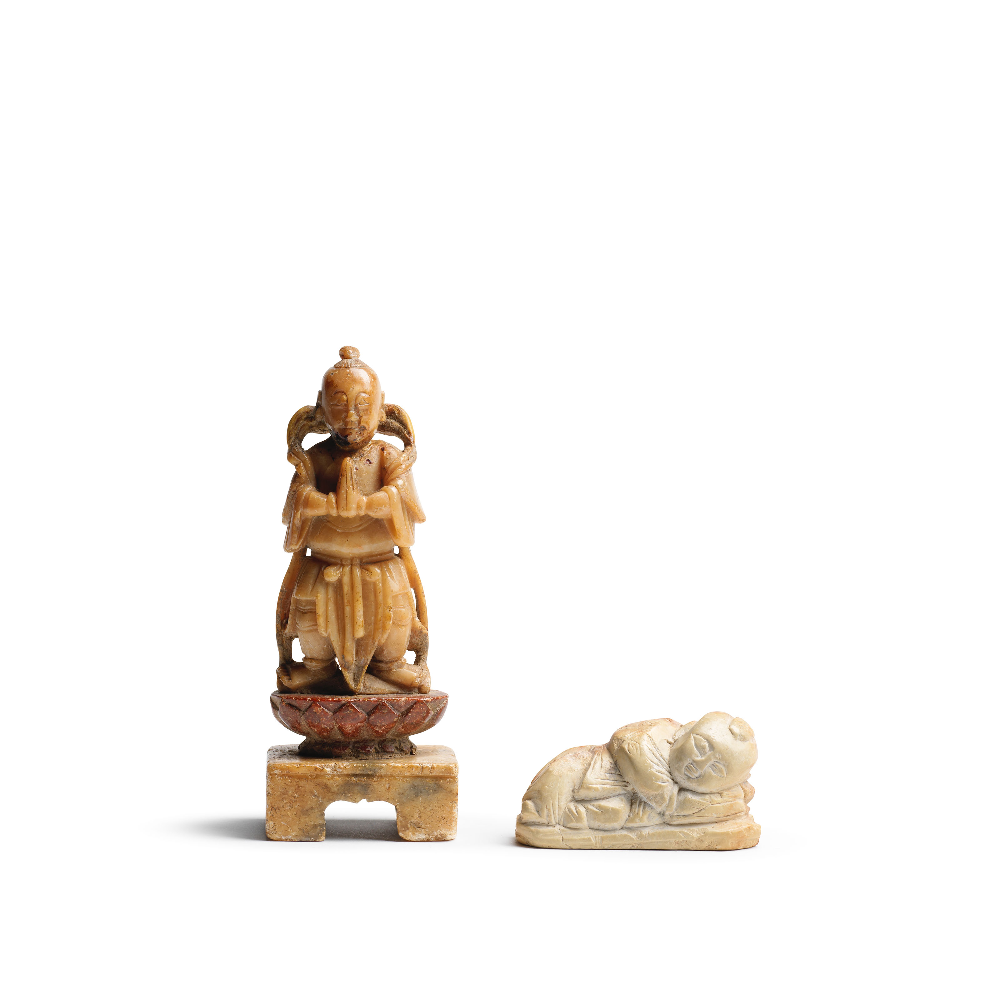 A CARVED SOAPSTONE ‘YOUNG BOY’ PAPER WEIGHT AND A SOAPSTONE ACOLYTE ...