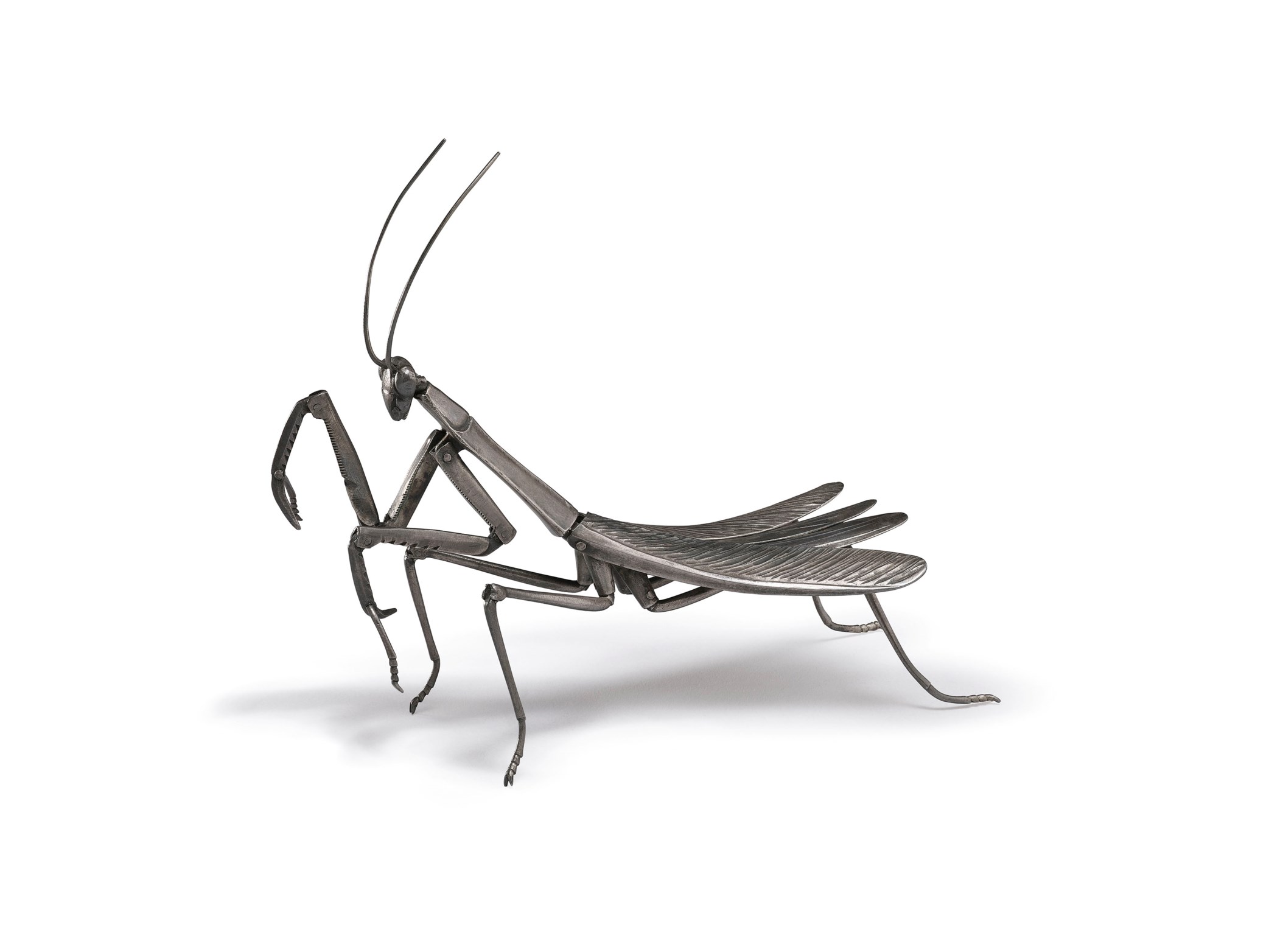 A silver articulated sculpture of a praying mantis, Meiji-Taisho period ...