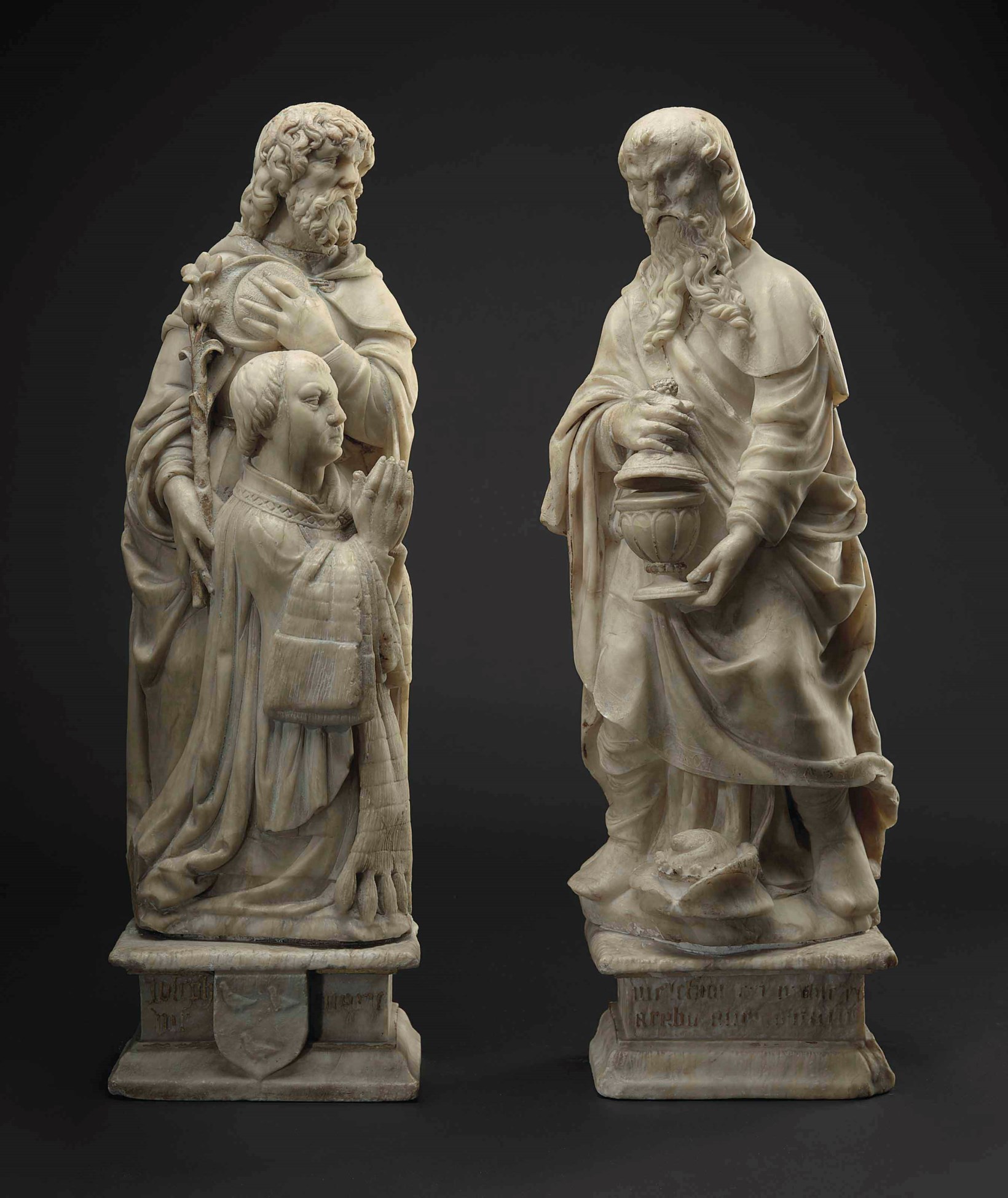 A PAIR OF LATE-GOTHIC ALABASTER FIGURES DEPICTING SAINT JOSEPH AND A ...