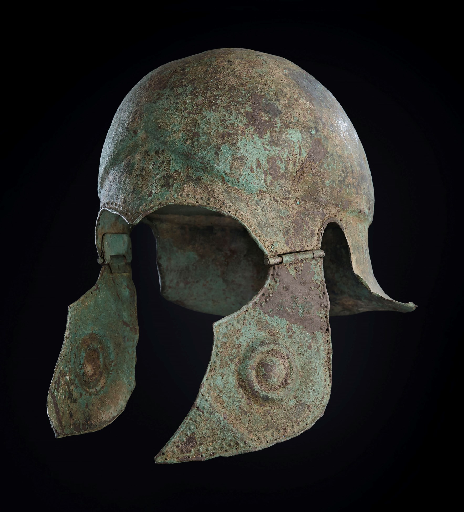 A GREEK BRONZE HELMET OF CHALCIDIAN TYPE , LATE CLASSICAL PERIOD, CIRCA ...