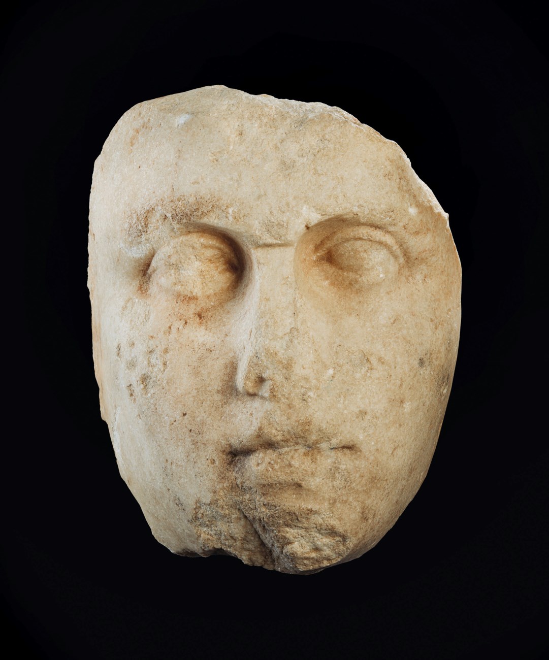 AN OVER-LIFESIZED GREEK MARBLE HEAD